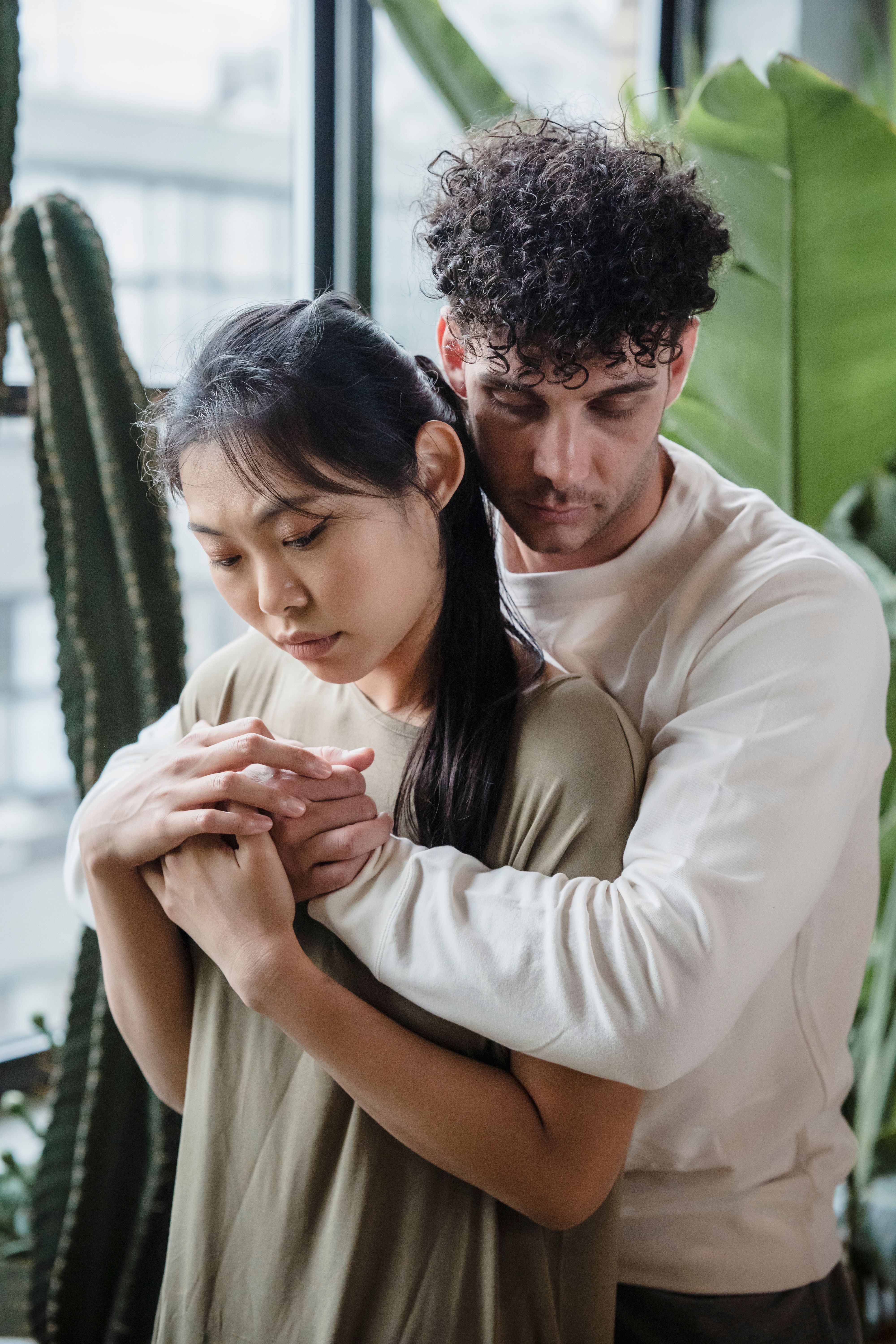 Man Hugging The Back A Woman · Free Stock Photo