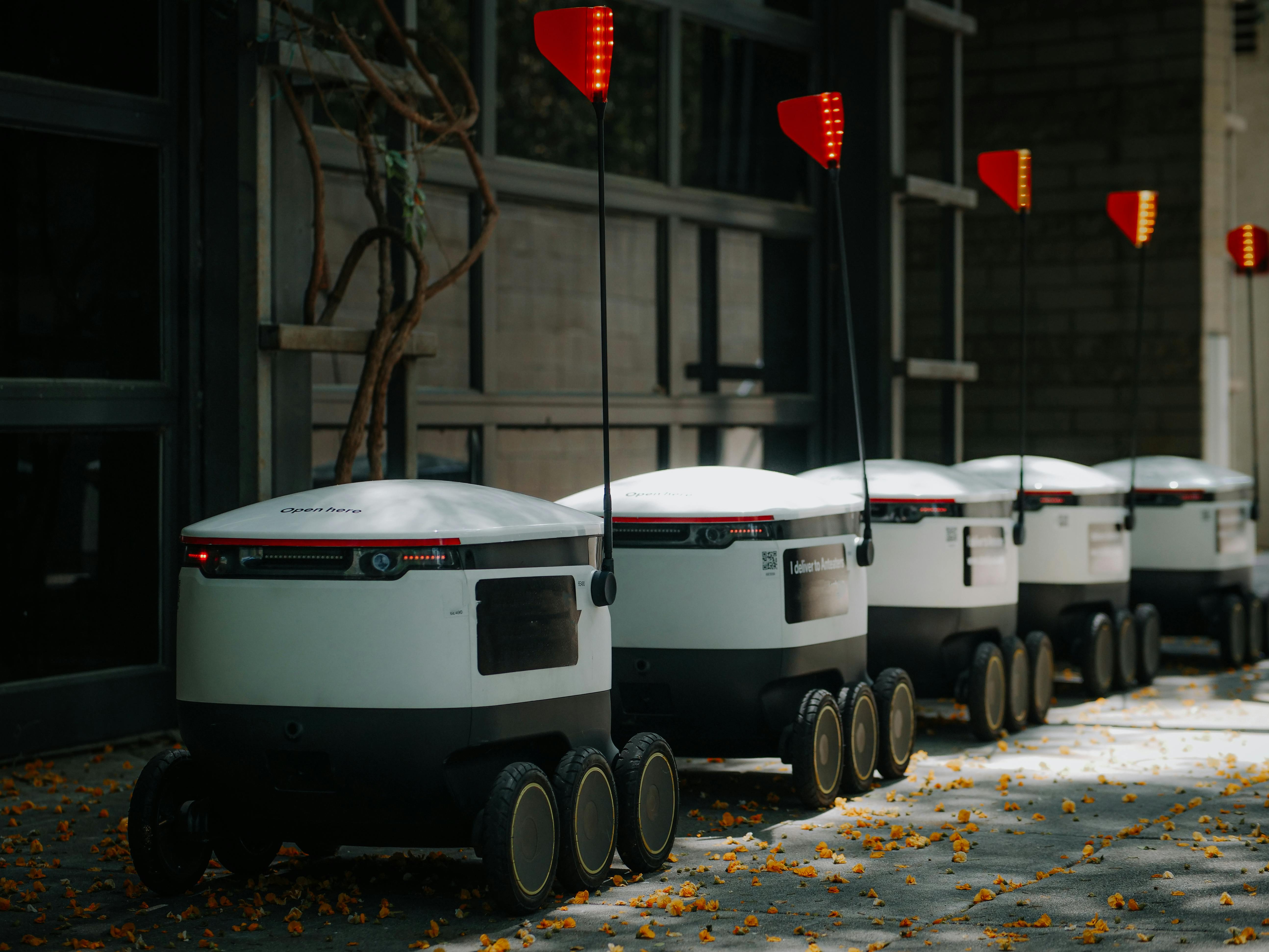 Delivery Robot on Pavement · Free Stock Photo