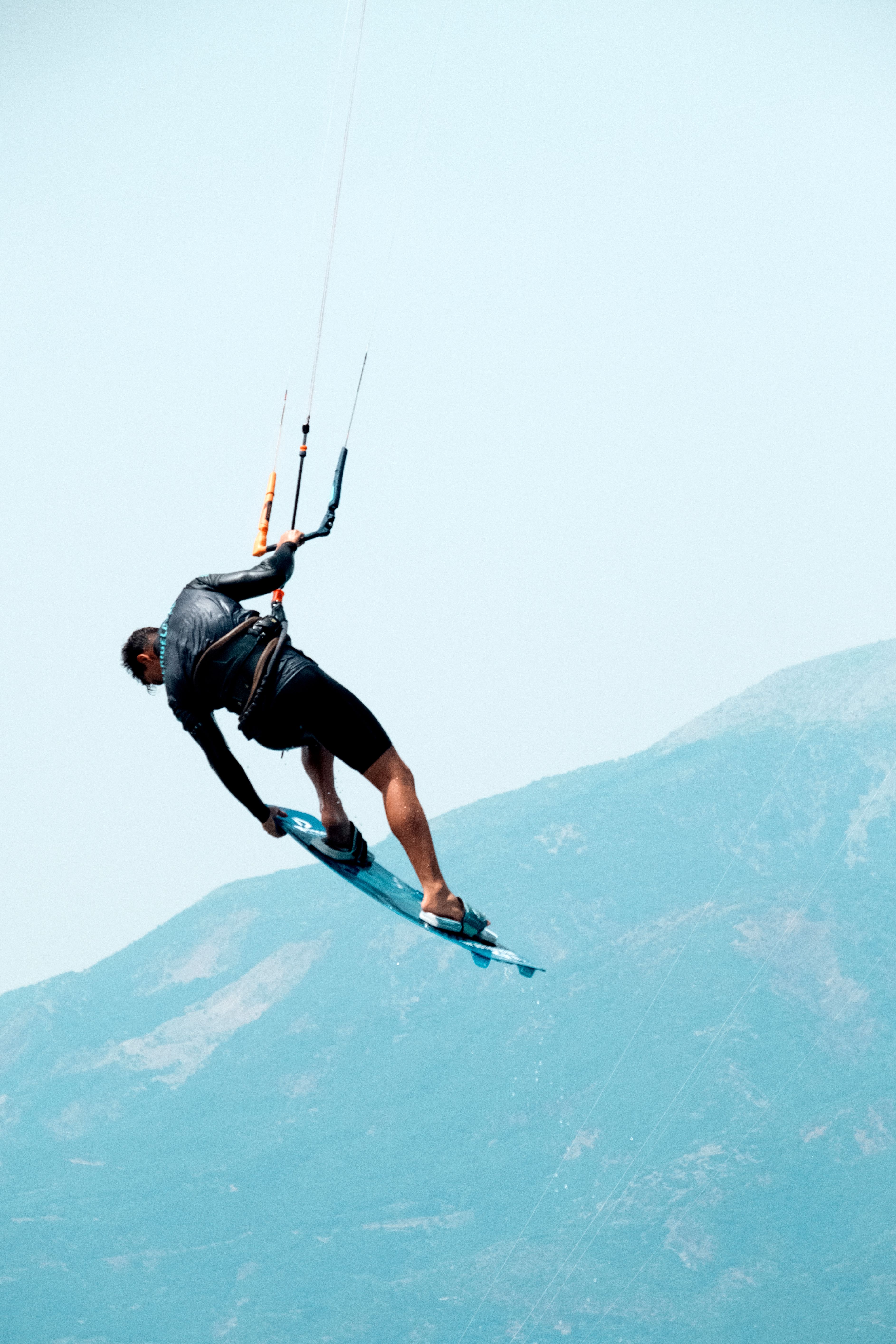 Silhouette of Three People Surfing · Free Stock Photo
