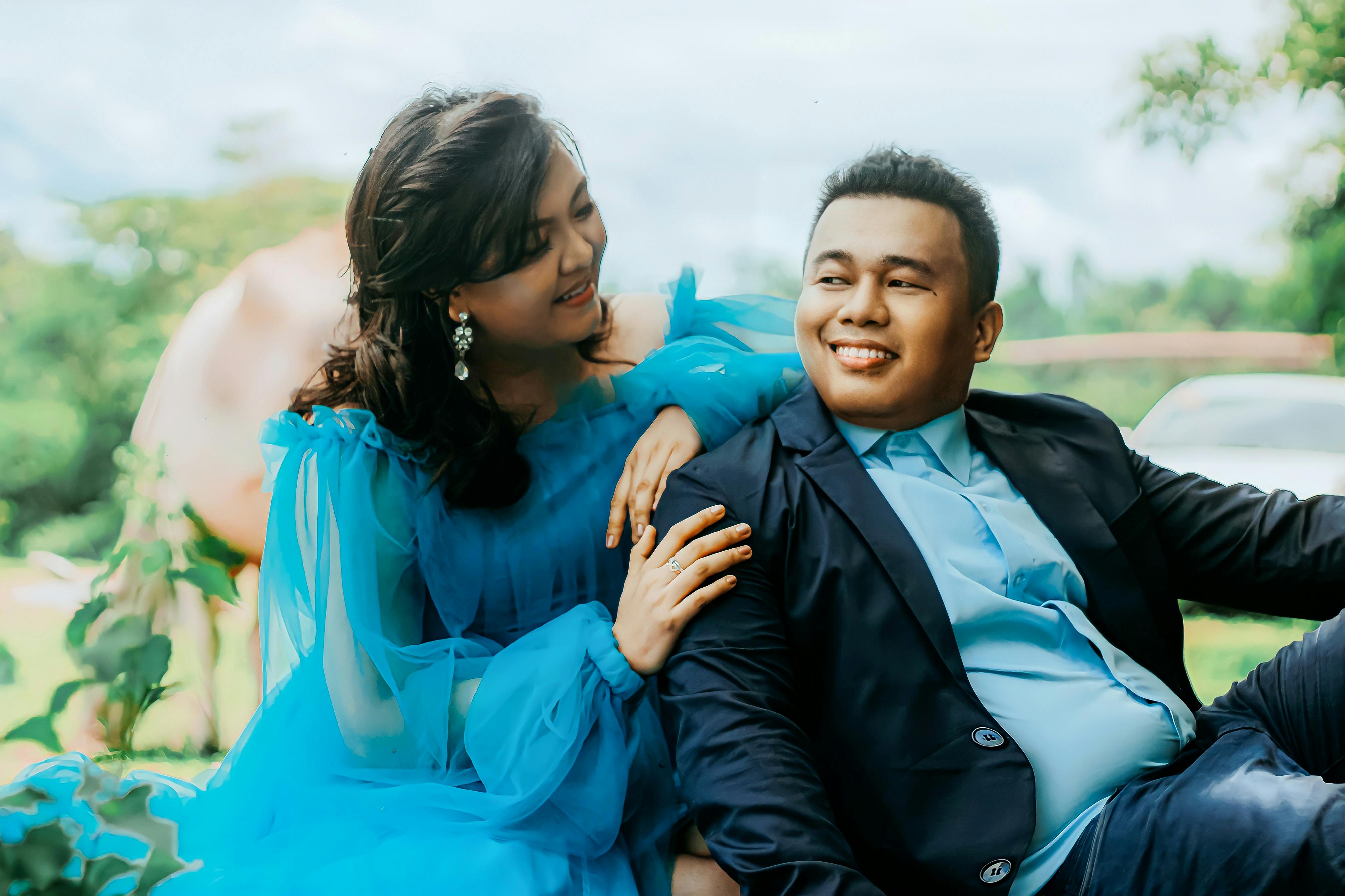 Man Leaning on Railing Beside a Woman · Free Stock Photo