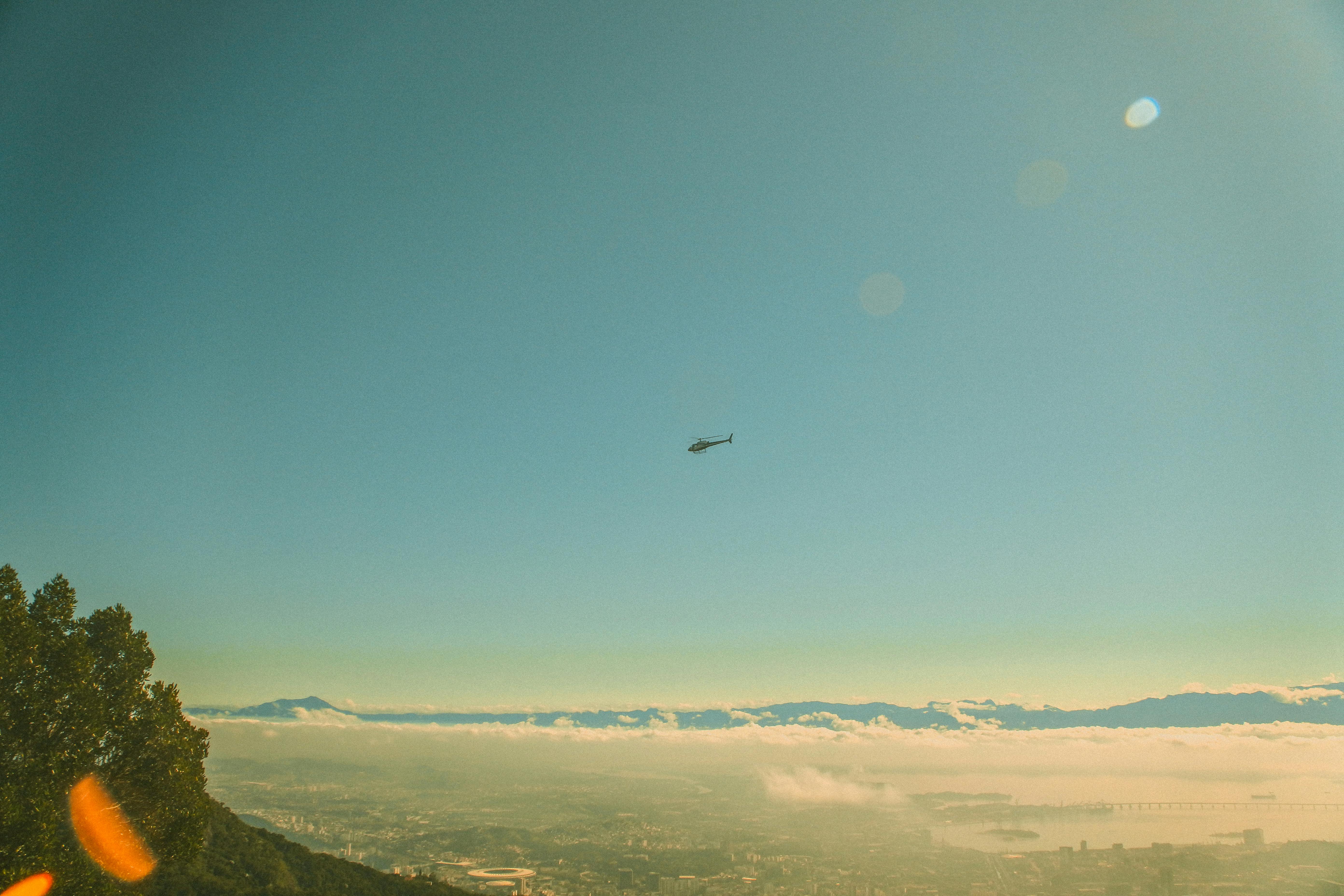 Chopper Flying against Blue Sky · Free Stock Photo