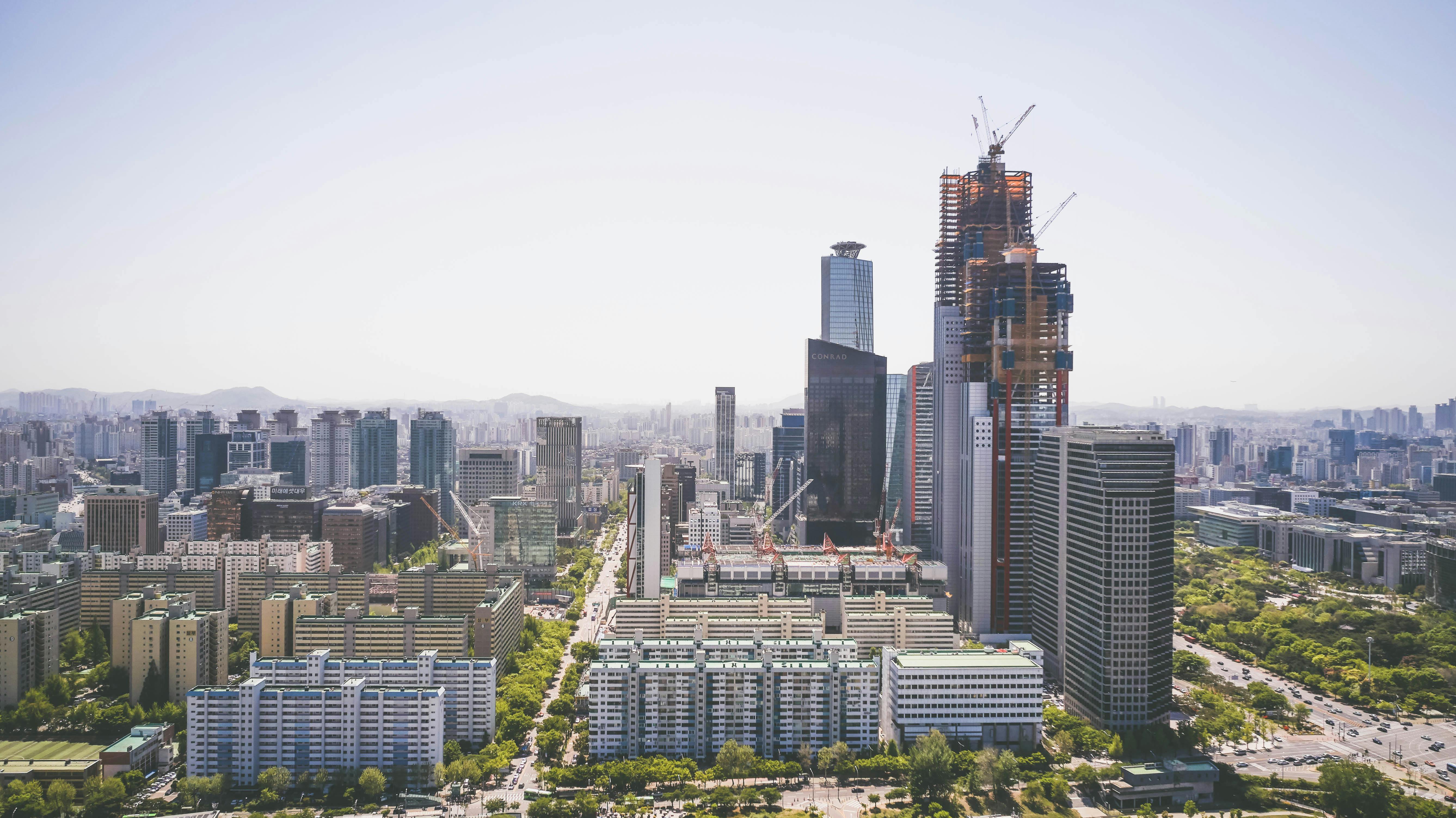 Aerial View of High-Rise Buildings at Night · Free Stock Photo