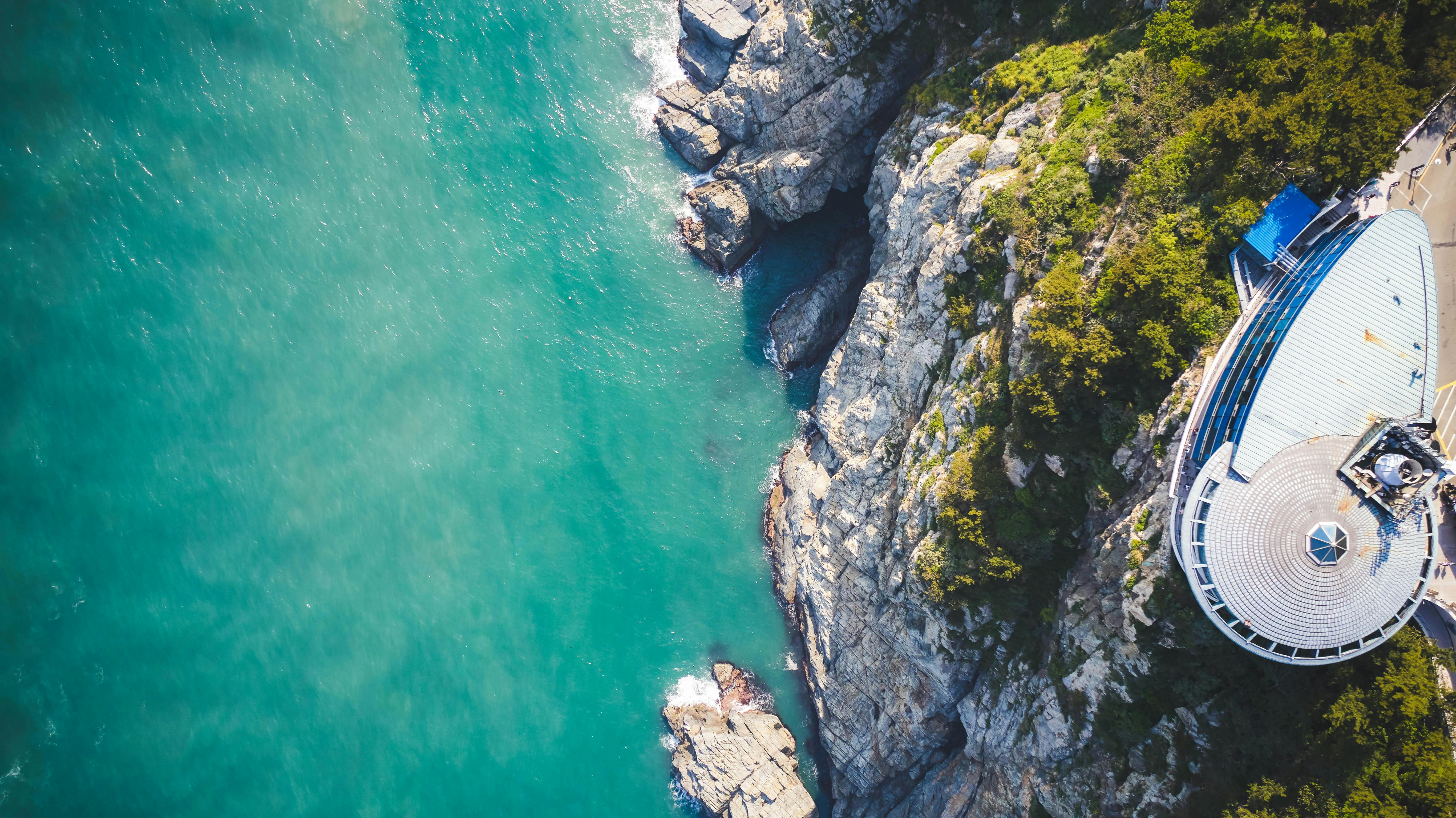 Aerial view of Rock Cliff Beside the Ocean · Free Stock Photo