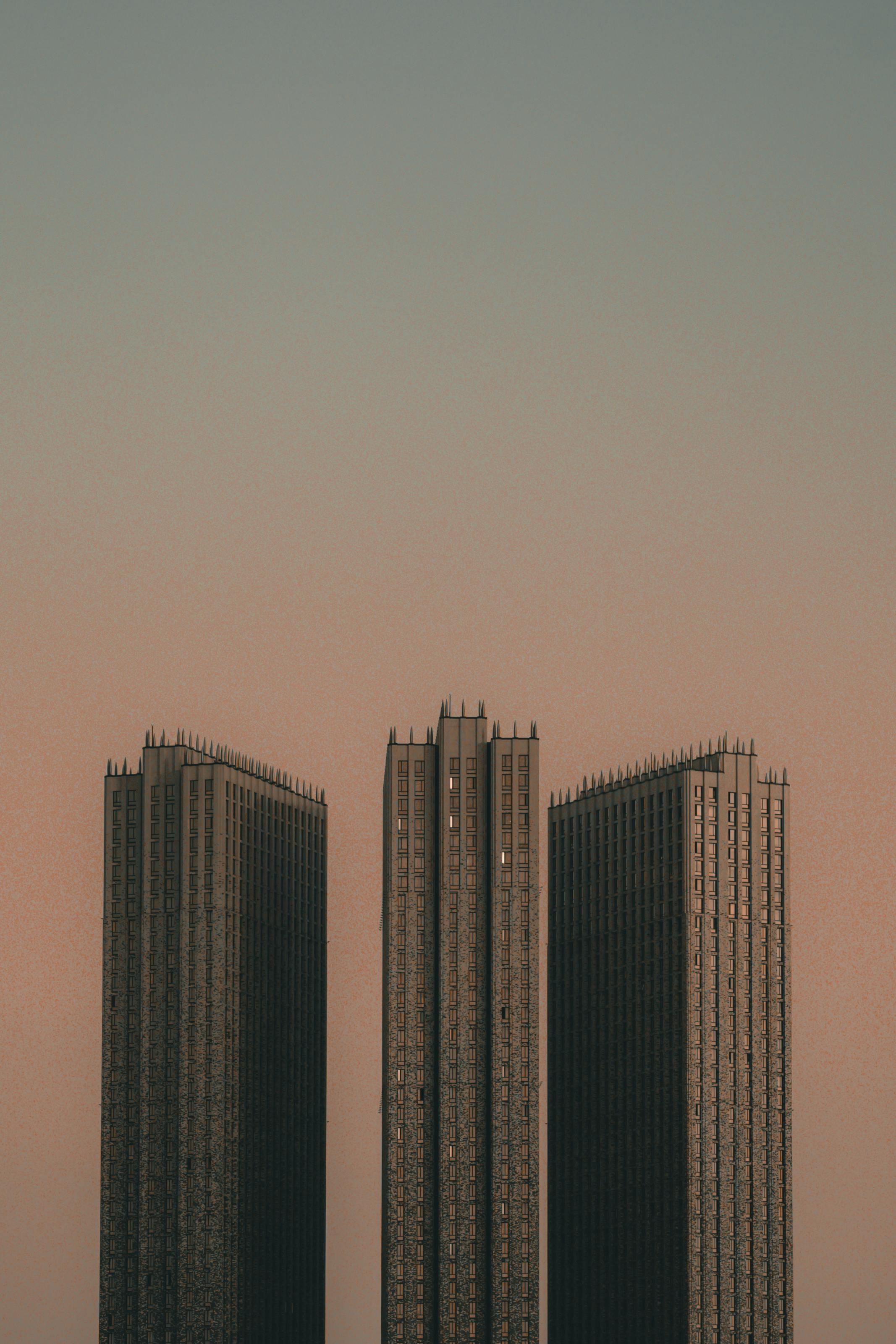 Three Brown High-Rise Buildings · Free Stock Photo