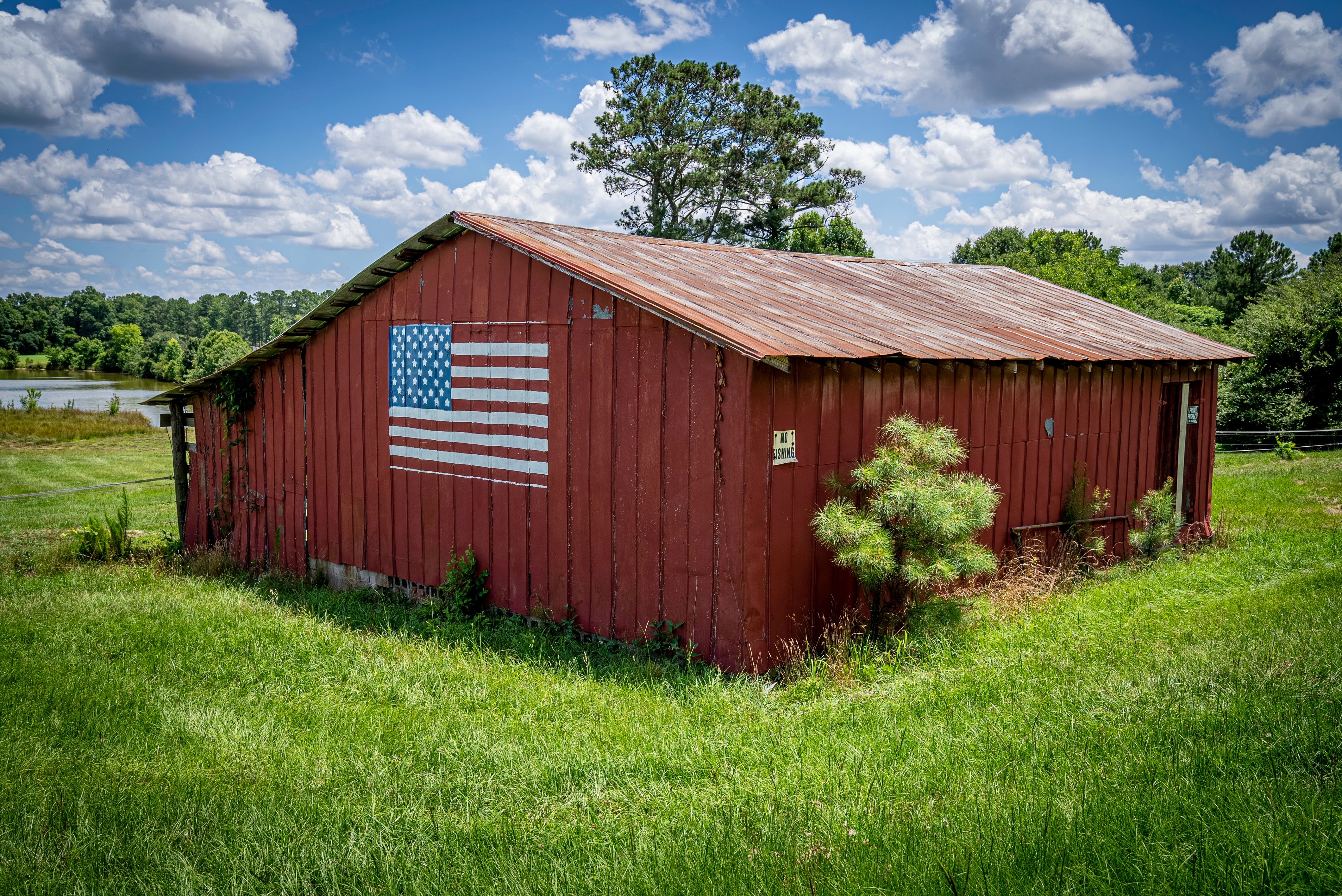 Red Wooden Barn on Green Grass Field · Free Stock Photo