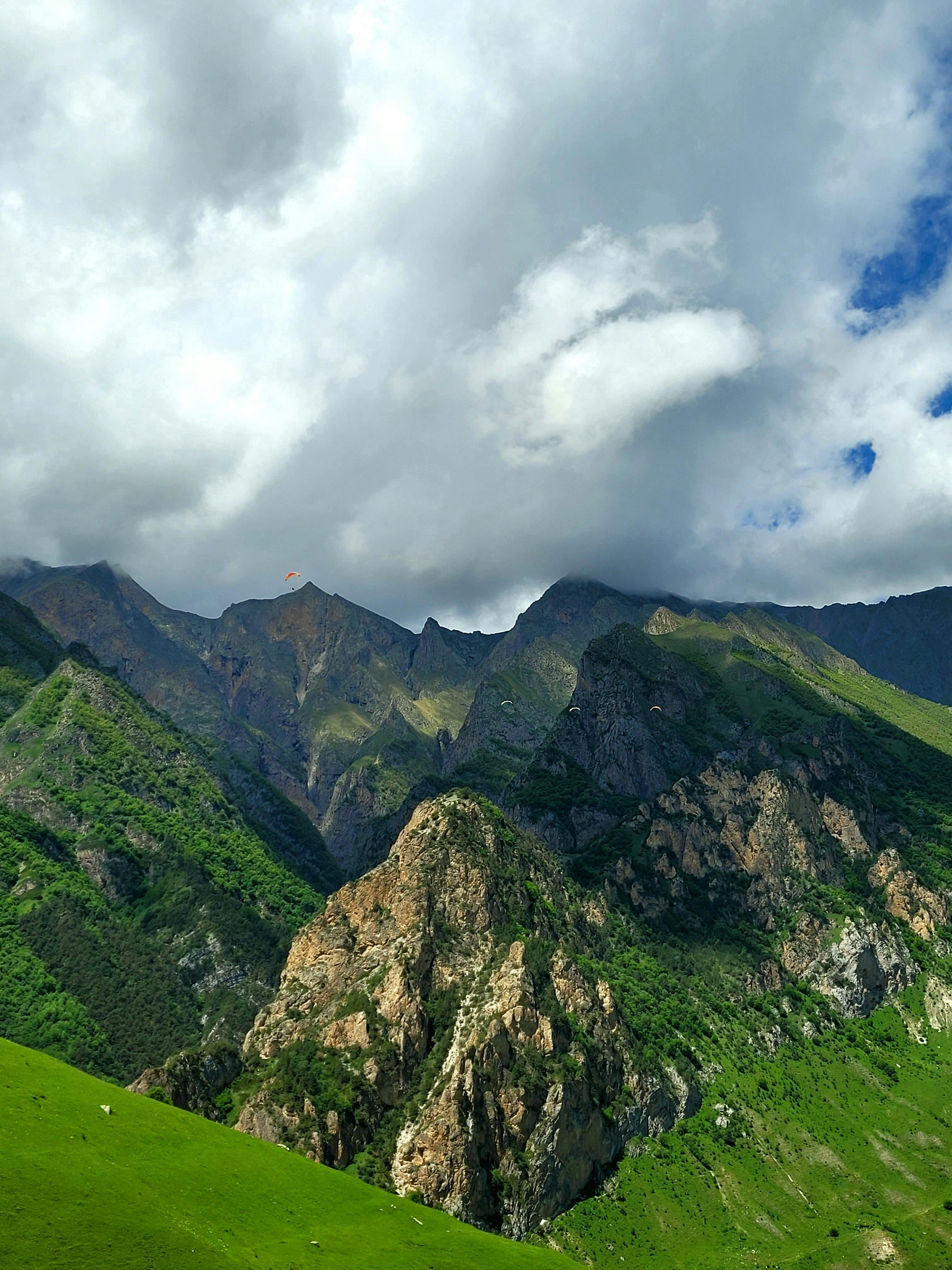 Clouds around Mountains Peaks · Free Stock Photo