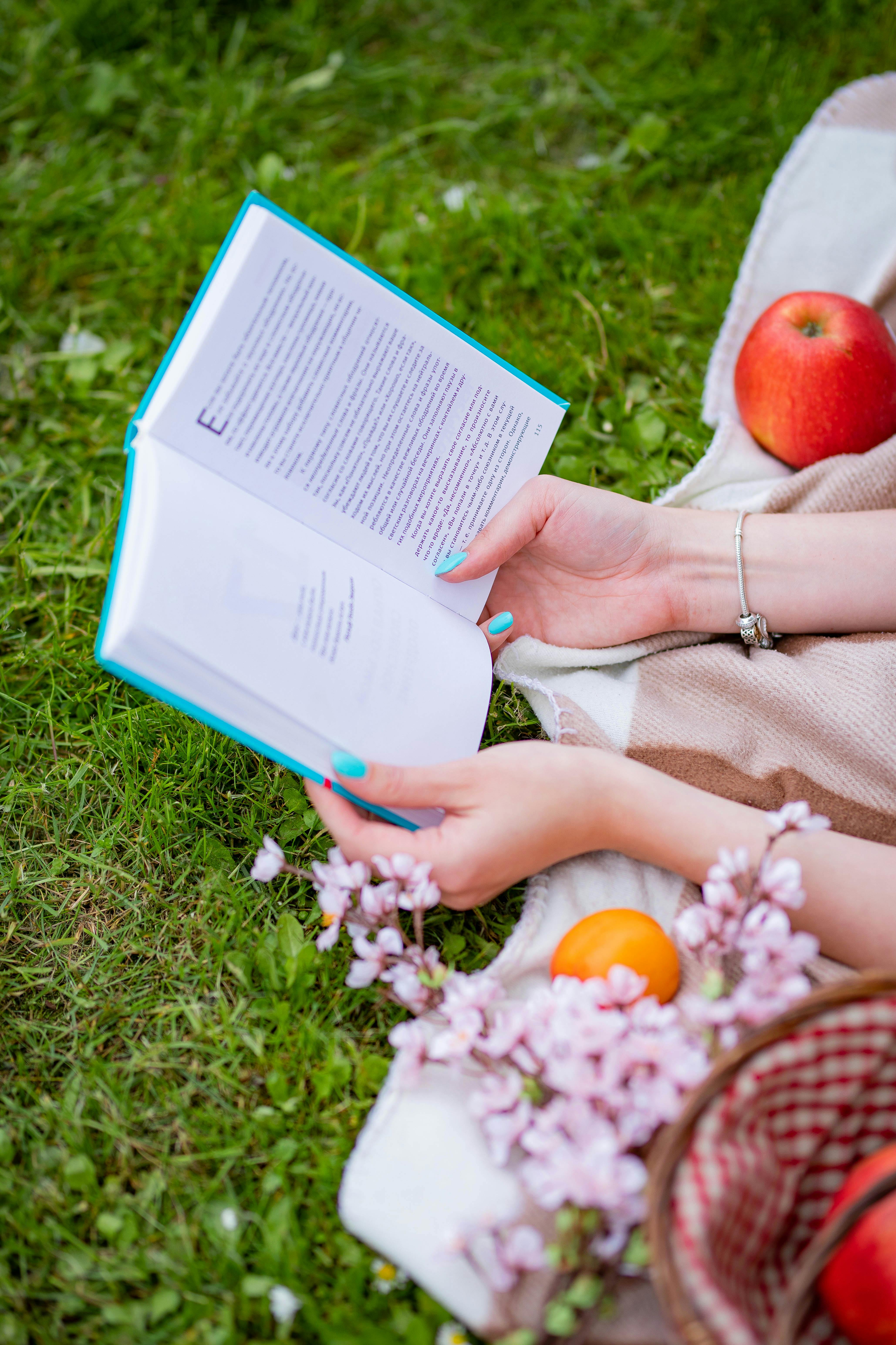 Woman on a Picnic Reading a Book · Free Stock Photo