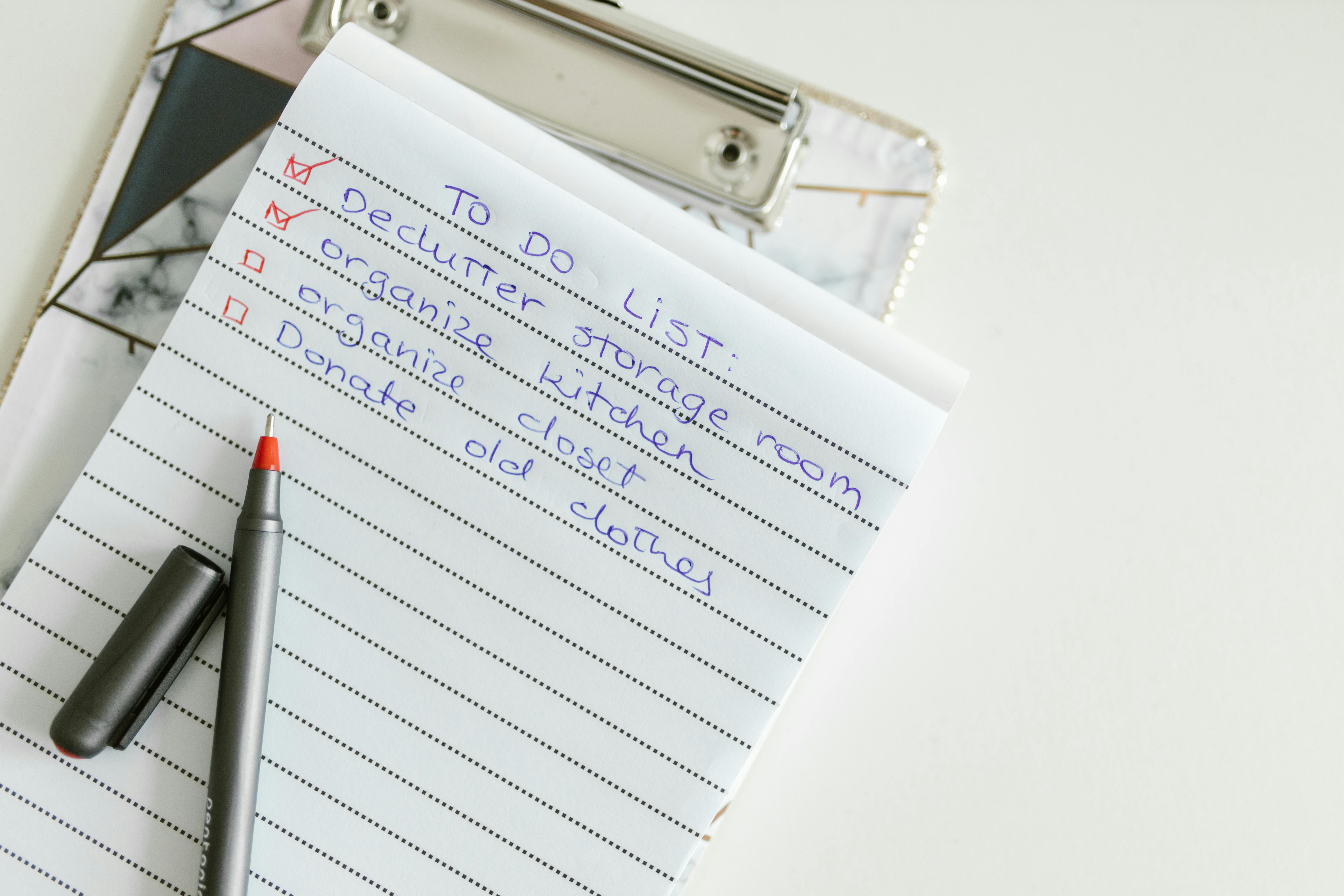 List Written in a Notepad With Pen · Free Stock Photo