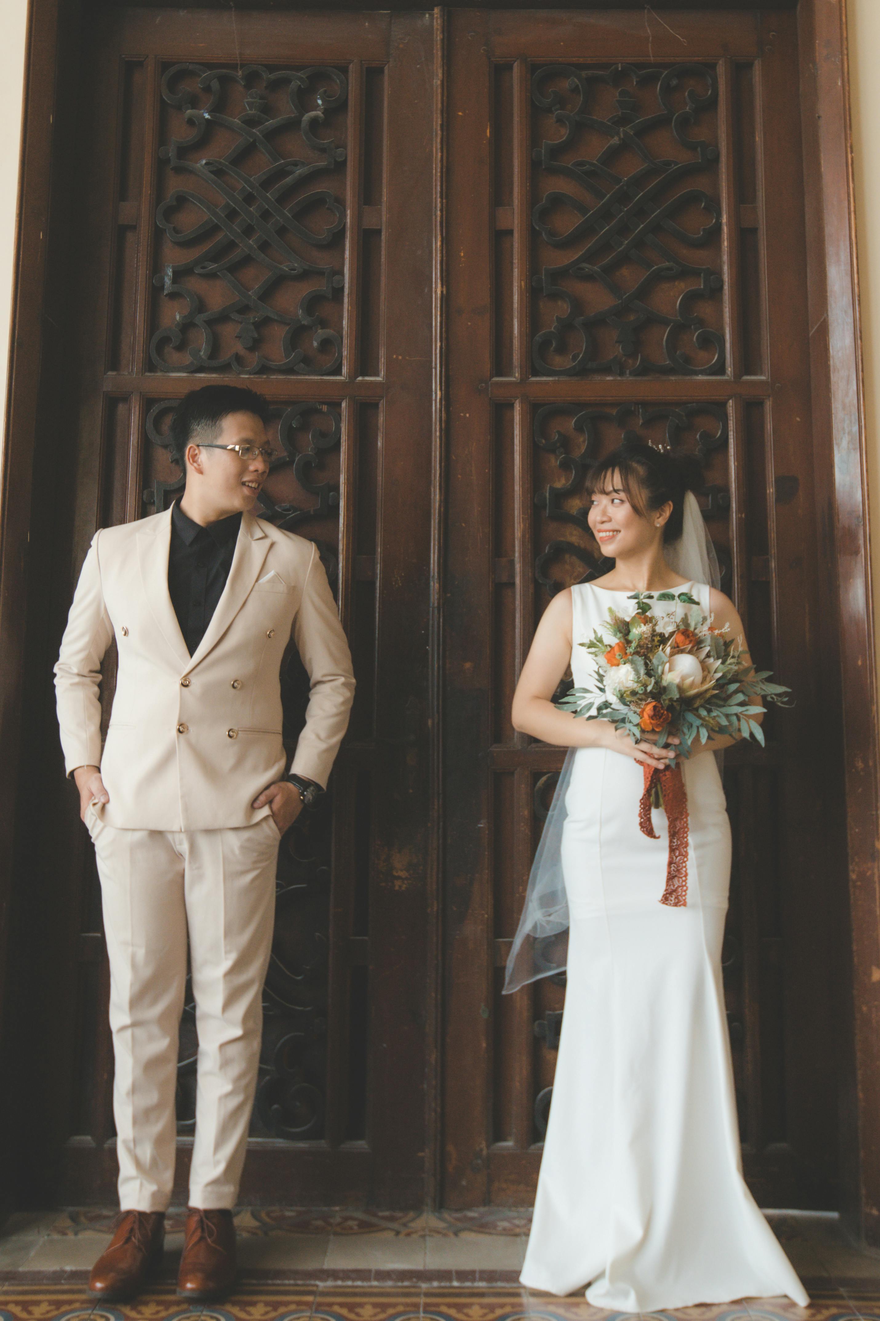 A Groom and Bride Looking at Each Other · Free Stock Photo