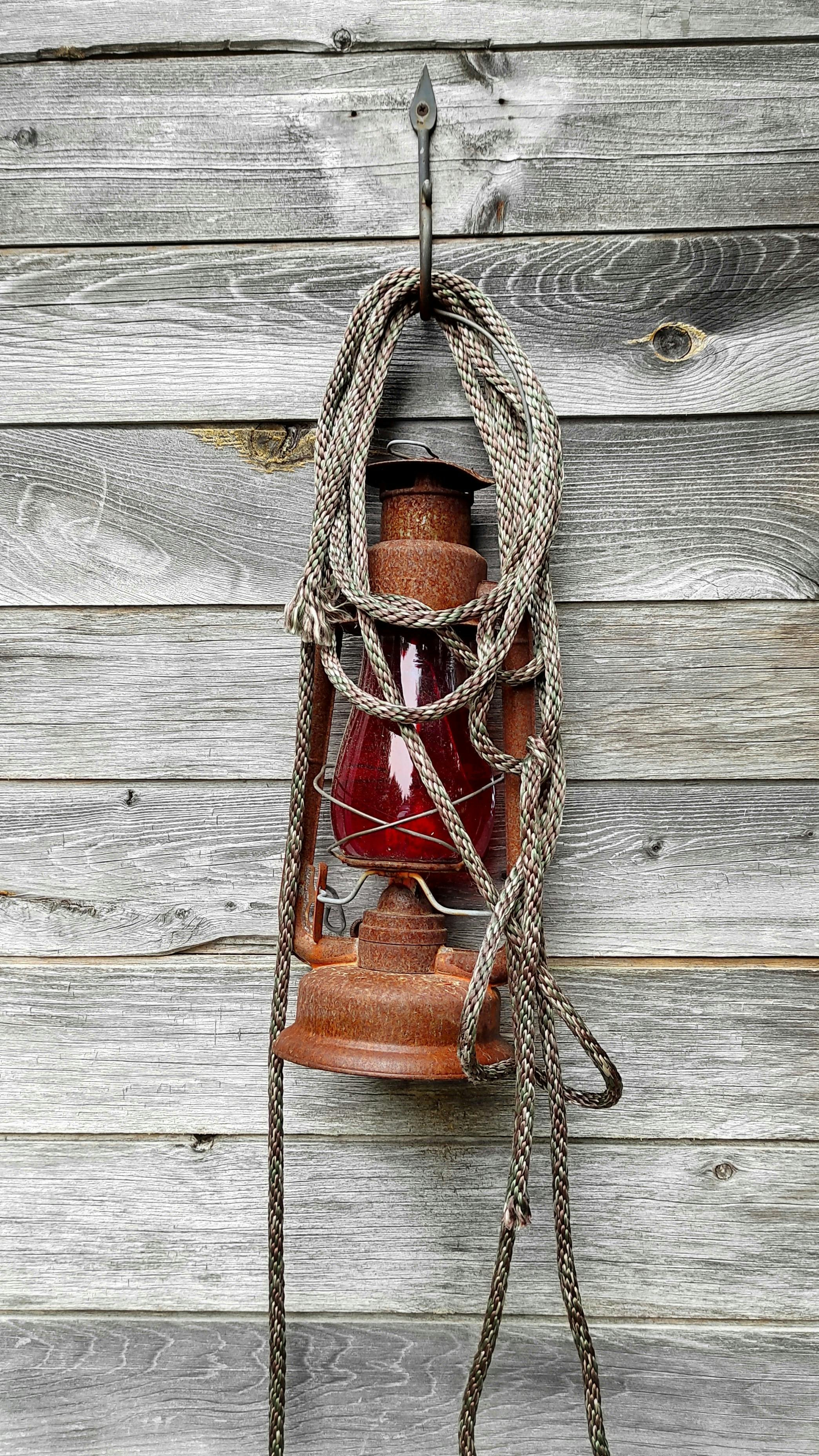 Rusty Lamp hanging on a Wooden Wall · Free Stock Photo