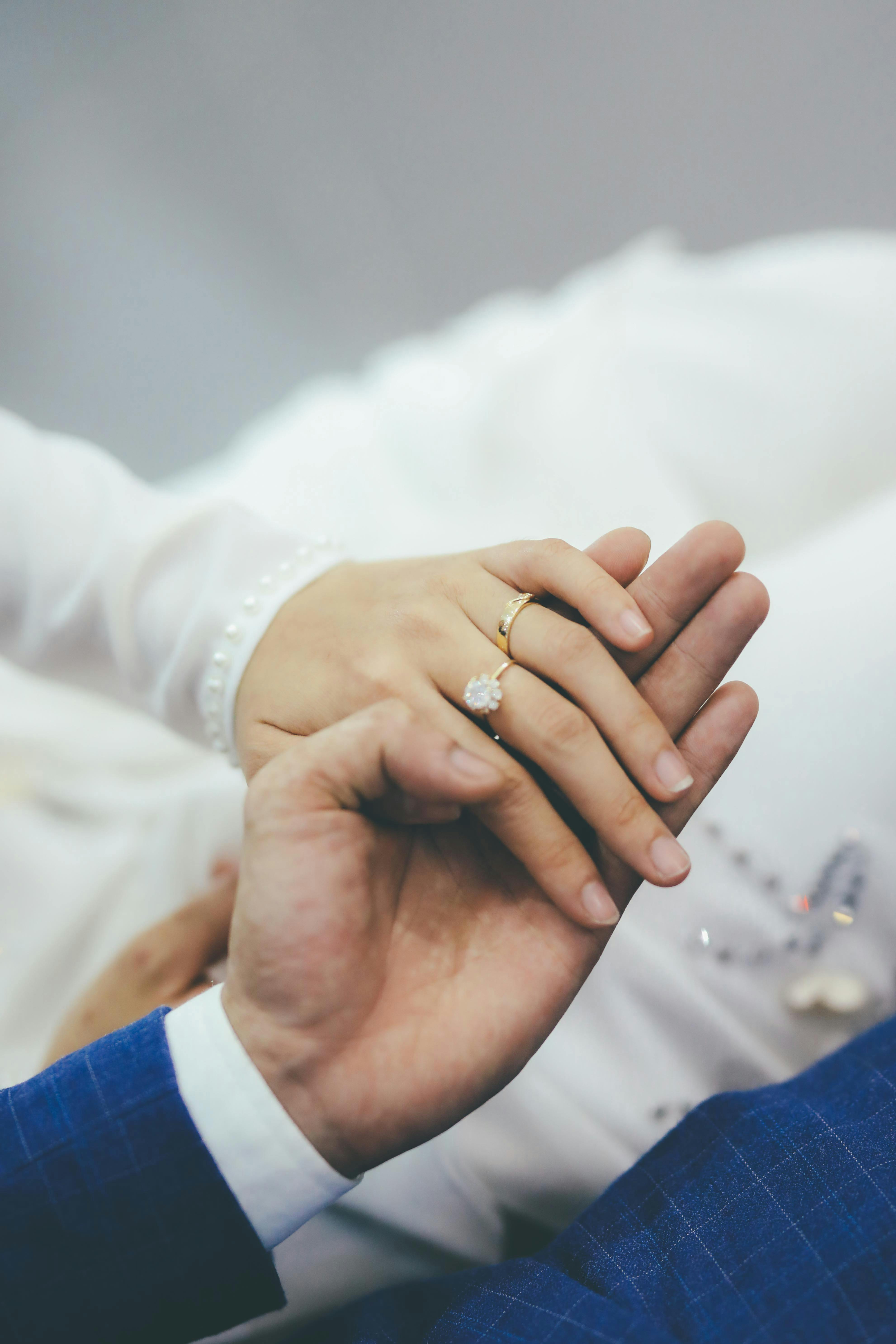 Ring With A Married Couple Holding Hands Free Stock Photo Of Couple