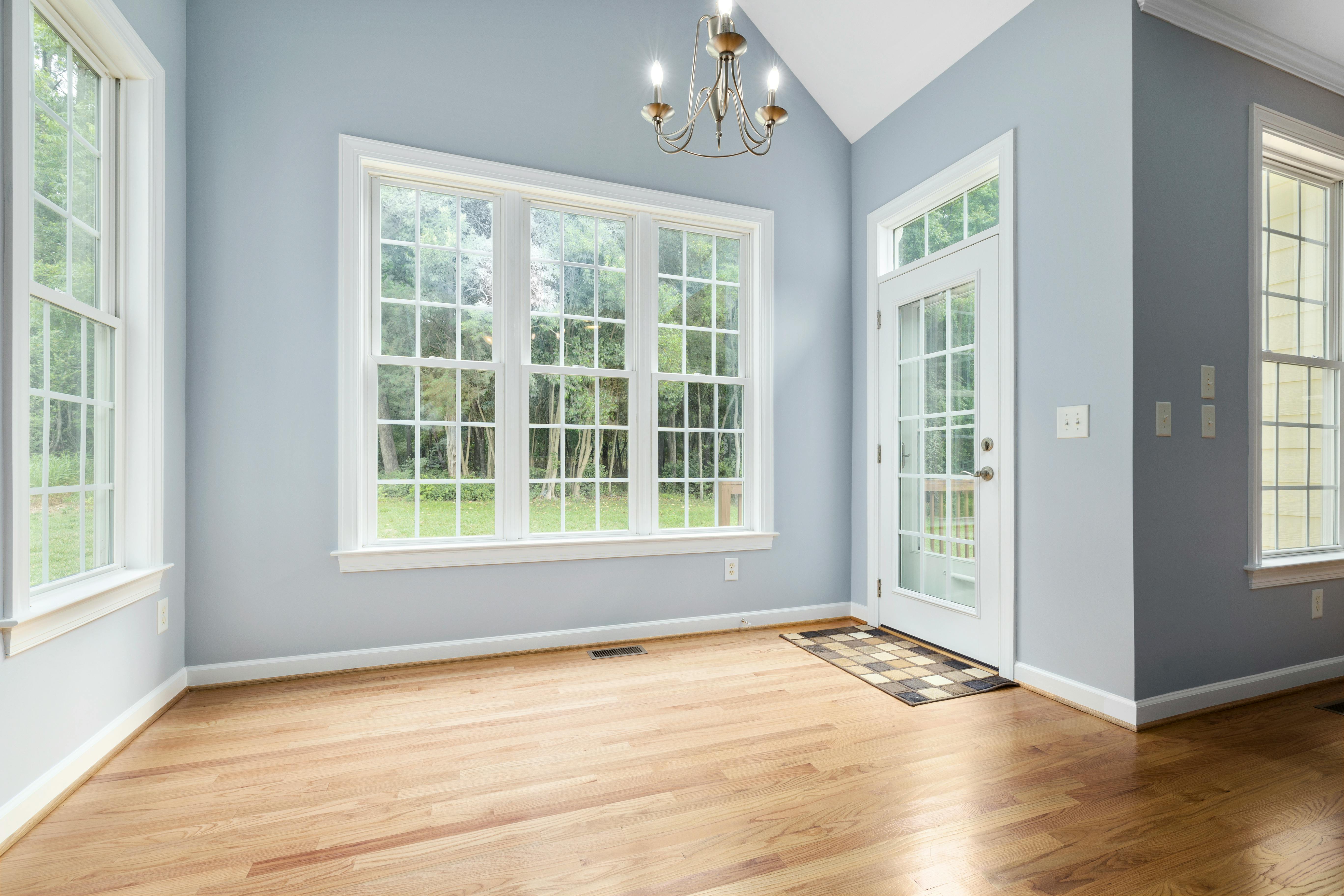 Light Blue Wall with White Framed Windows · Free Stock Photo