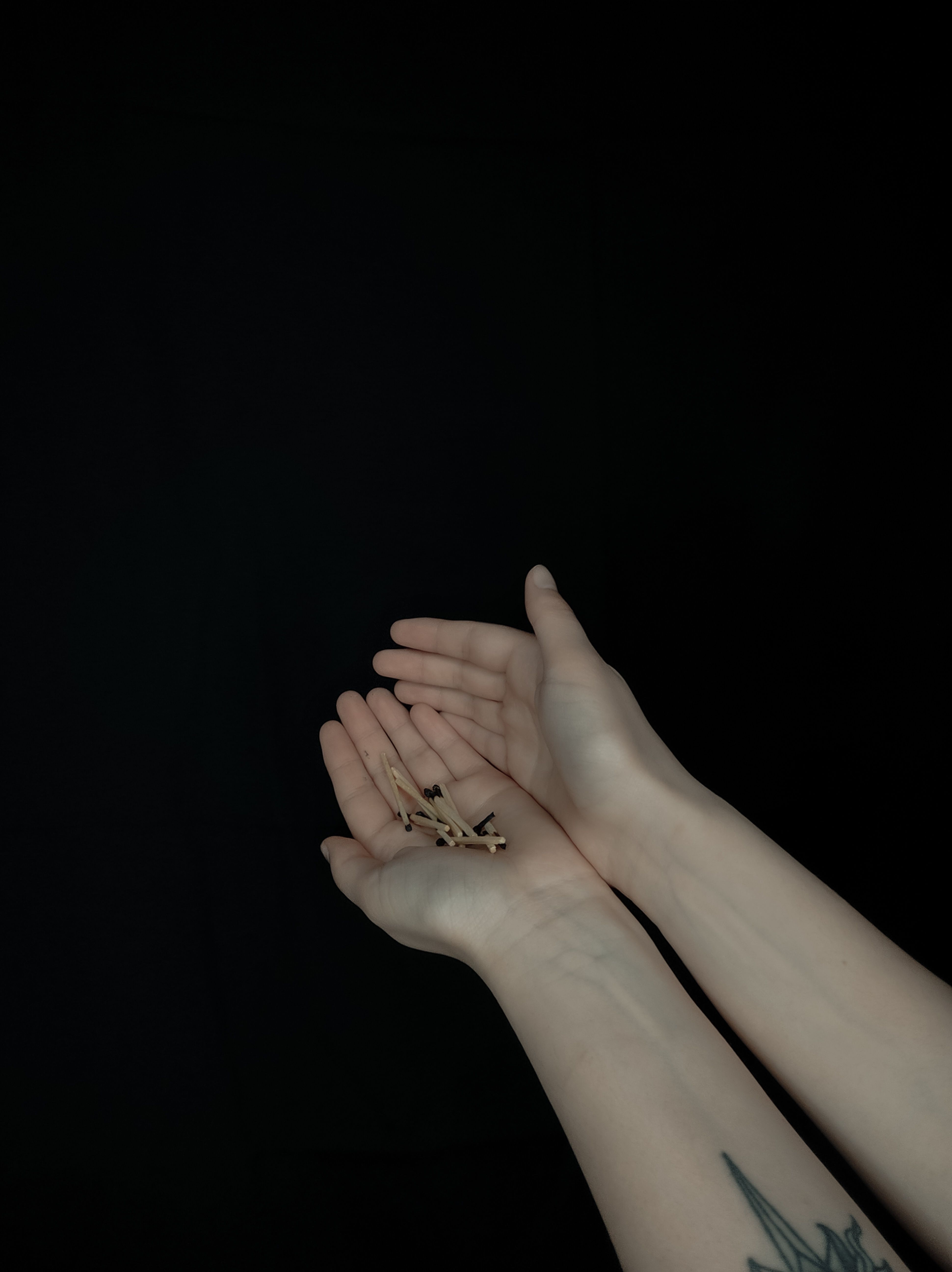 A Person Holding a Match Stick · Free Stock Photo