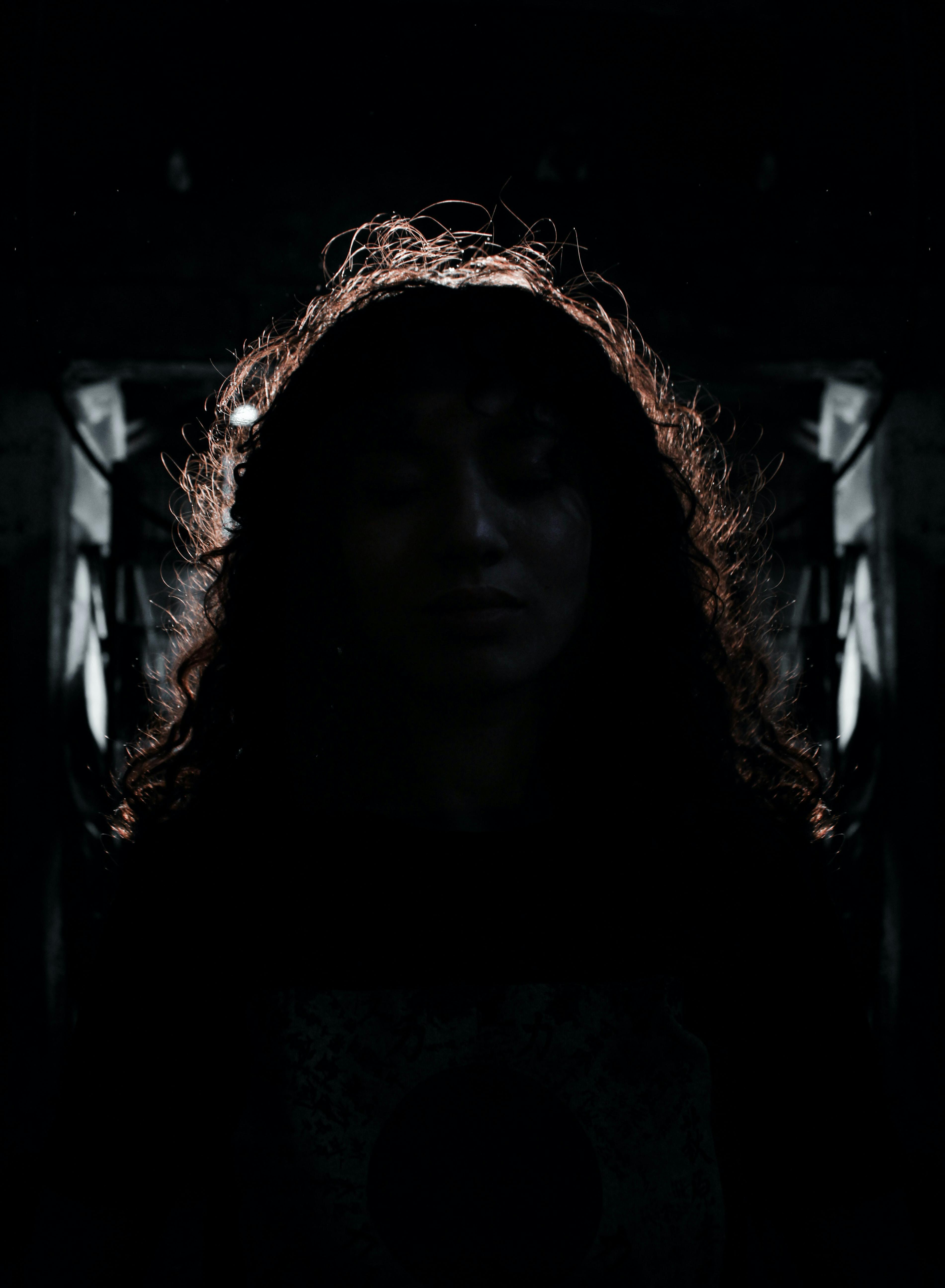 Person's Head in a Dark Room · Free Stock Photo