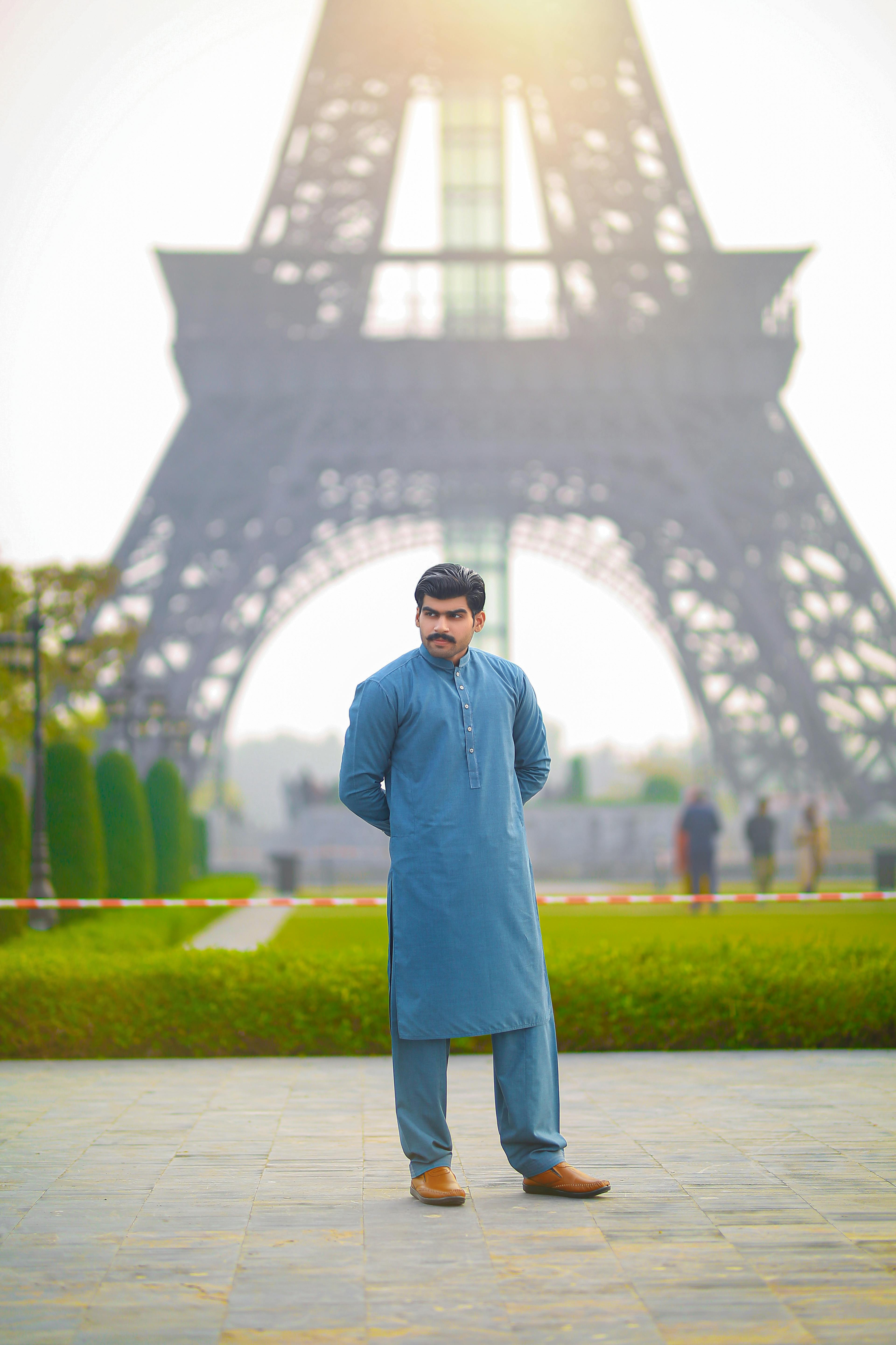 Man in White Robe Standing on the Lakeshore · Free Stock Photo