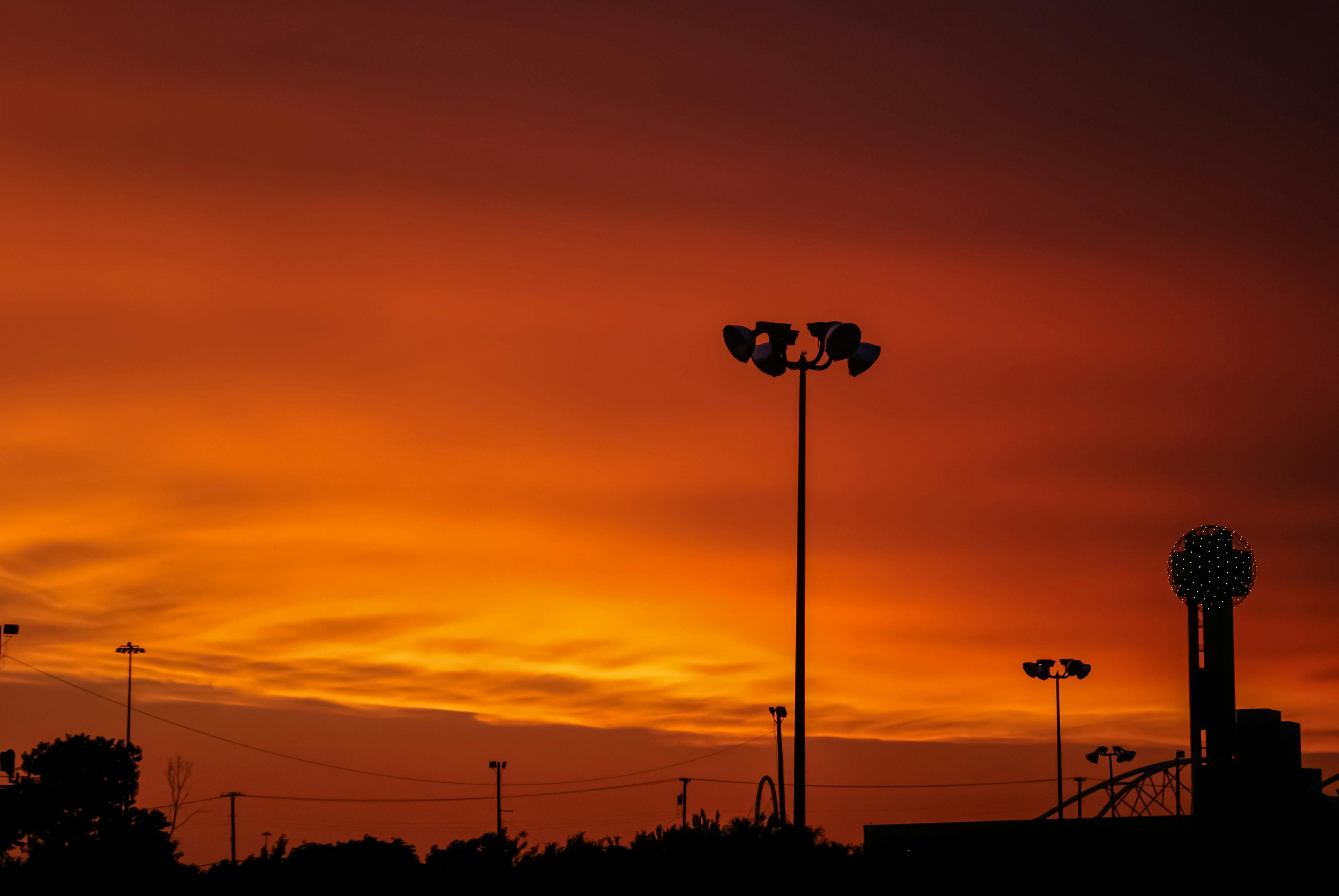 Silhouette of Street Lights during Sunset · Free Stock Photo