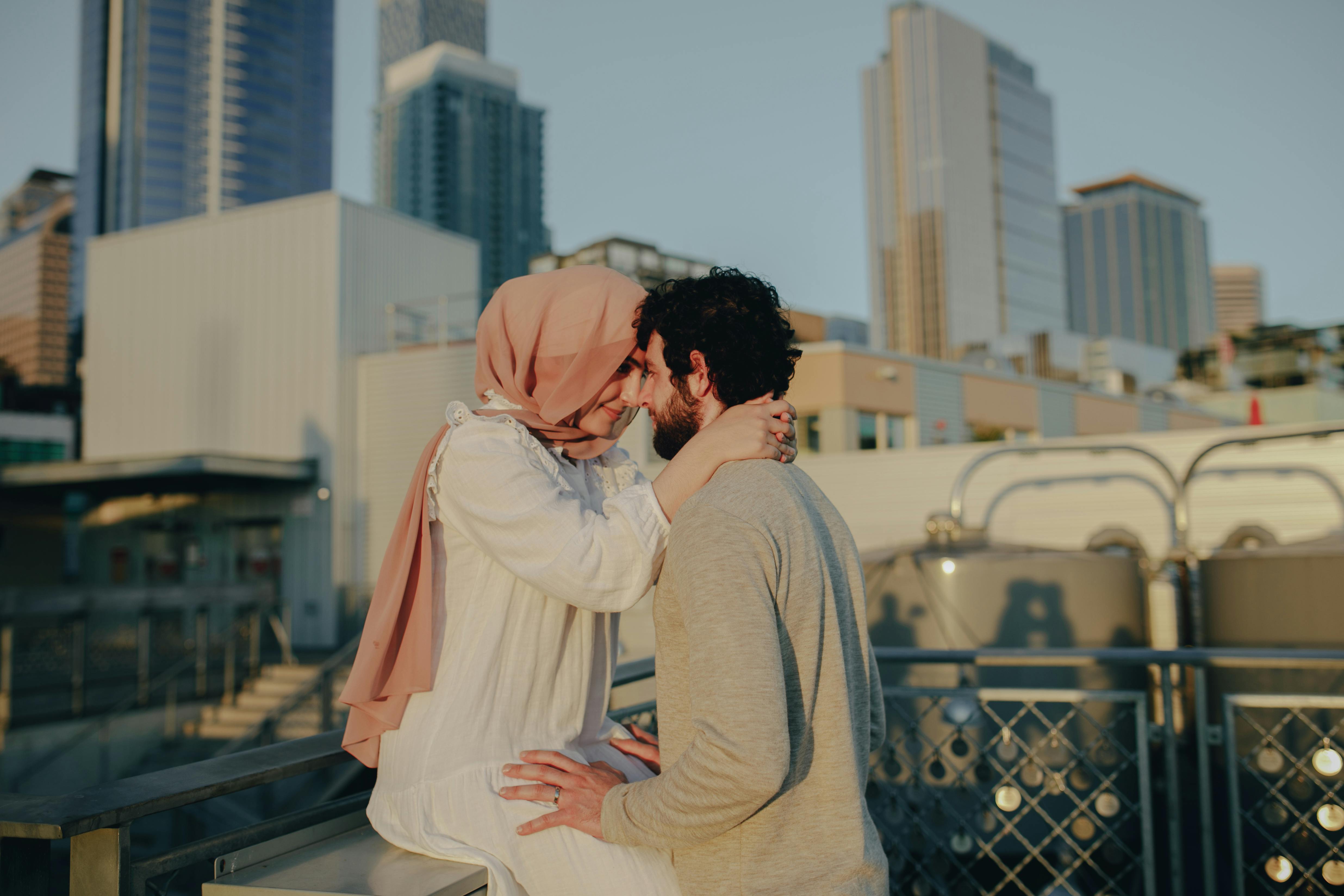 A Woman Wearing Hijab Hugging a Man in Front · Free Stock Photo