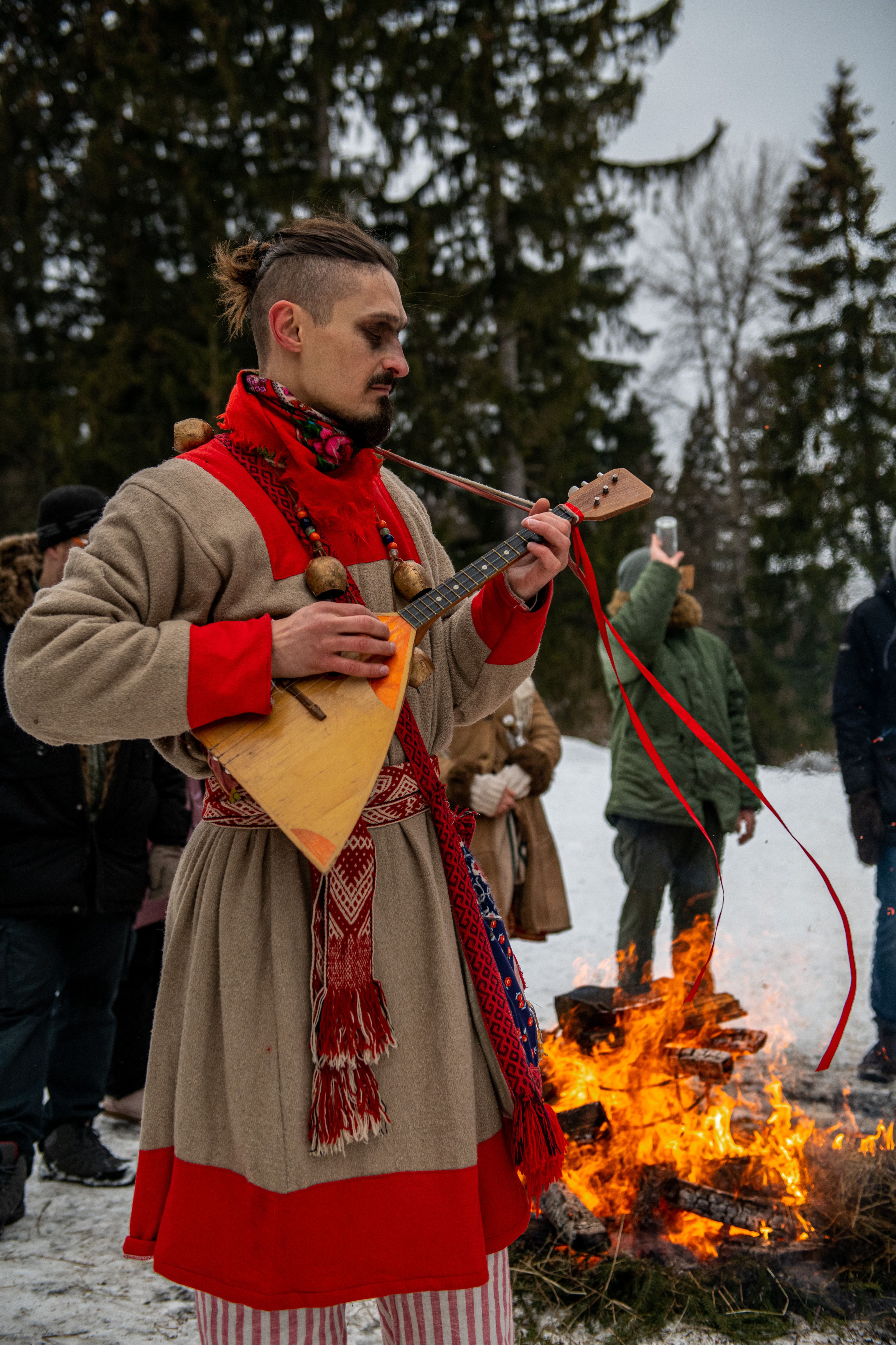 A Man in Traditional Wear Playing the Balalaika During the Maslenita ...
