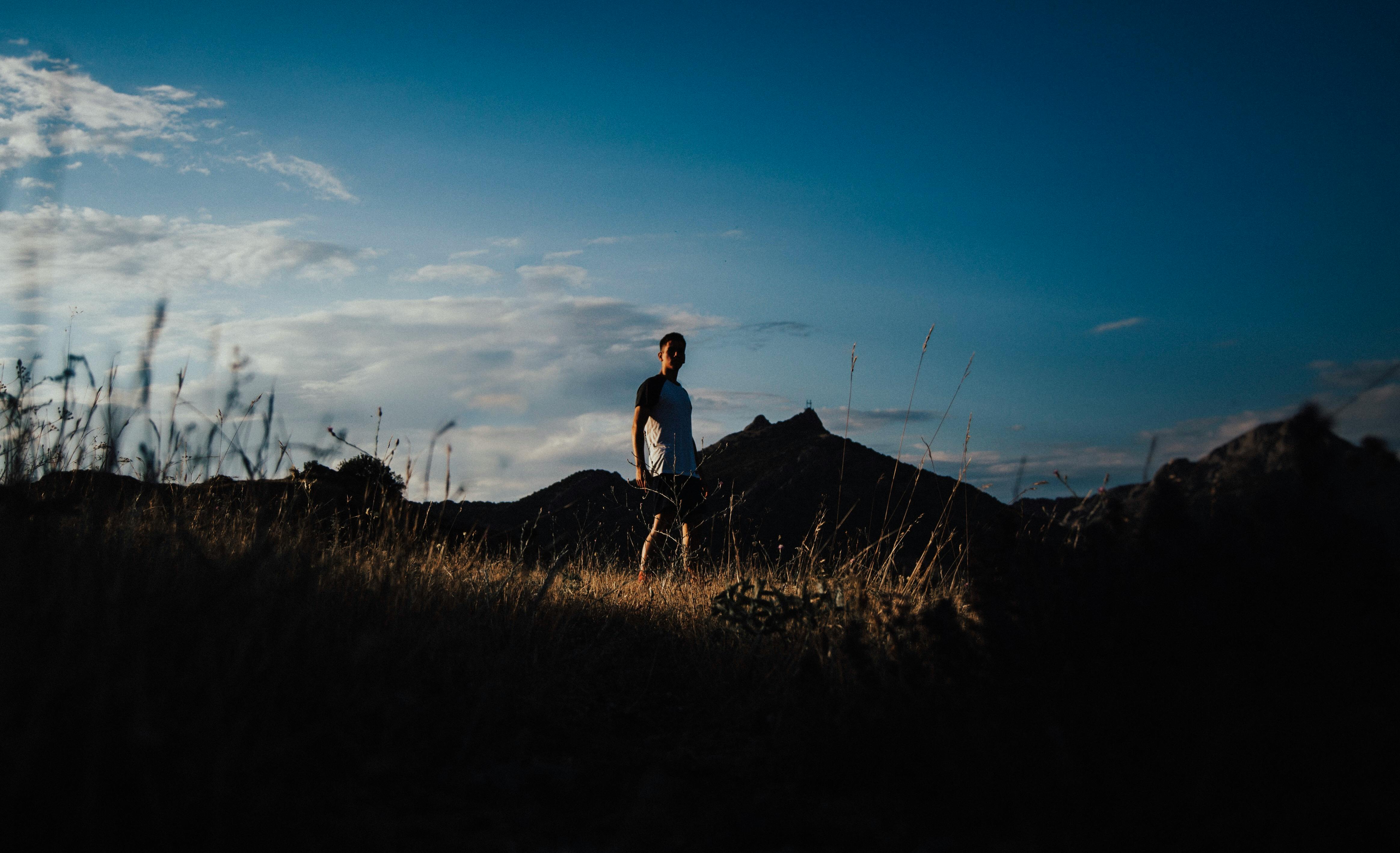 Low Angle Photography of Man Drinking Gray Labeled Can · Free Stock Photo