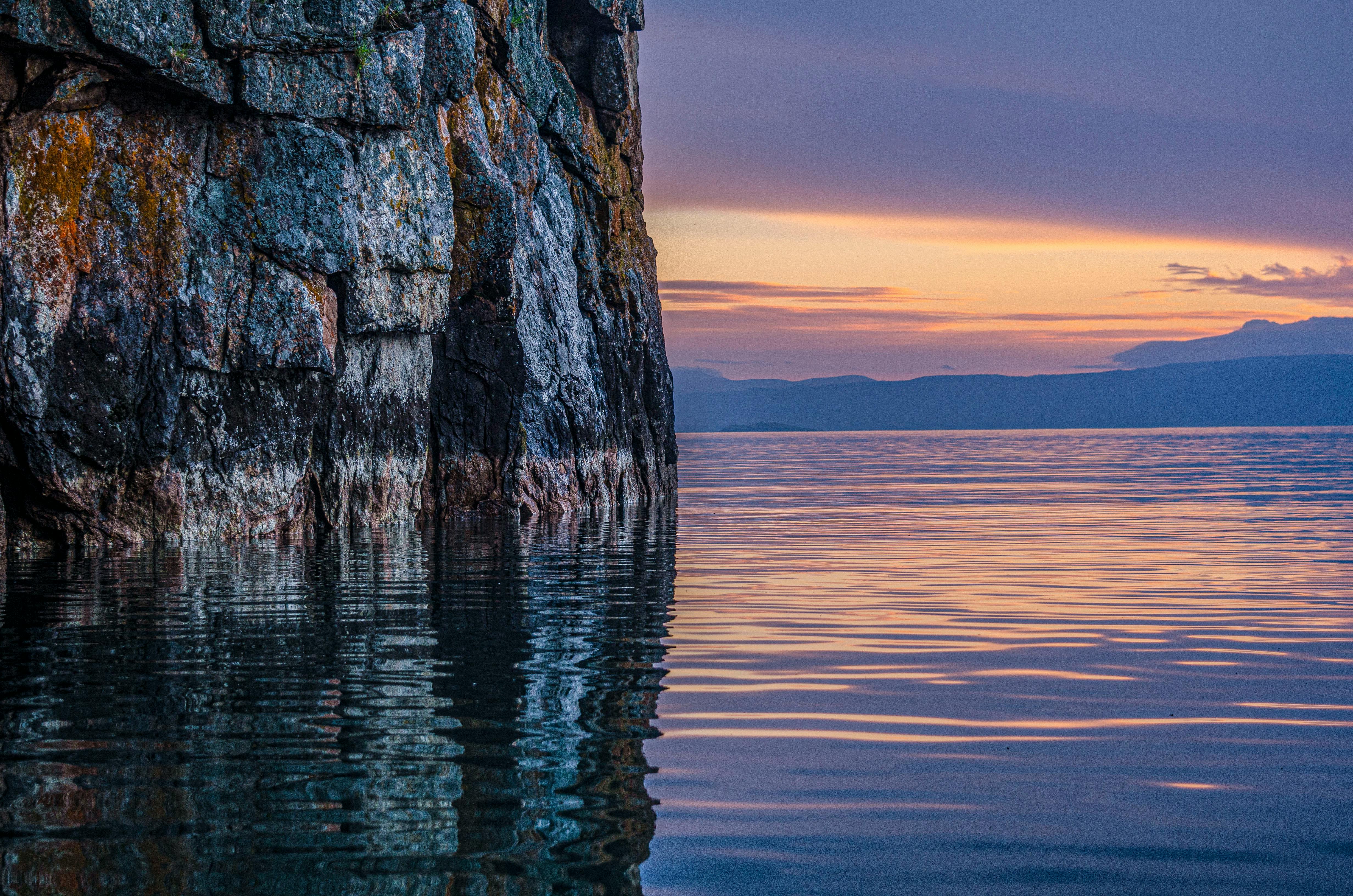 Scenic Photo of Cliffside During Dusk · Free Stock Photo