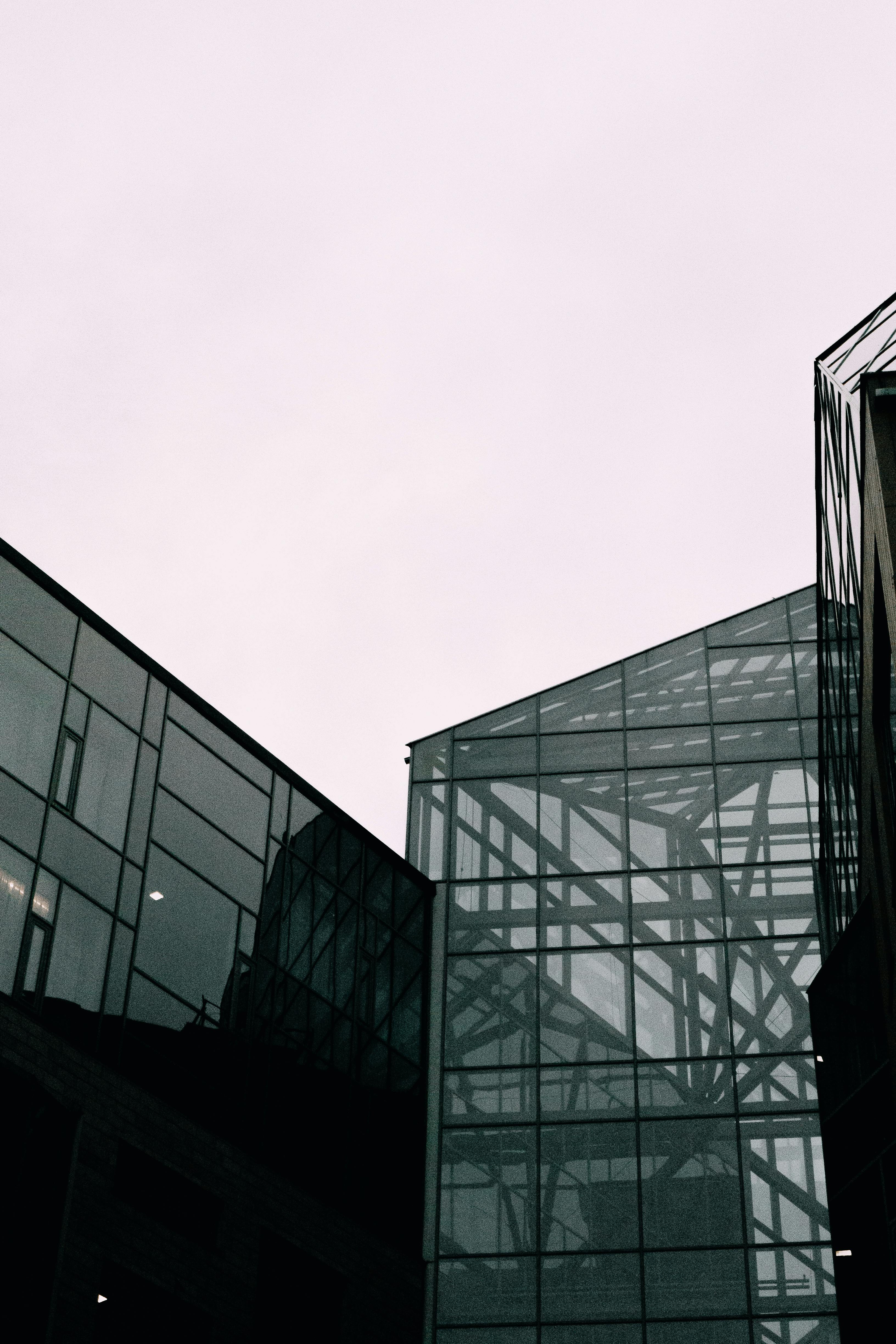 Low Angle Shot of a Glass Building · Free Stock Photo
