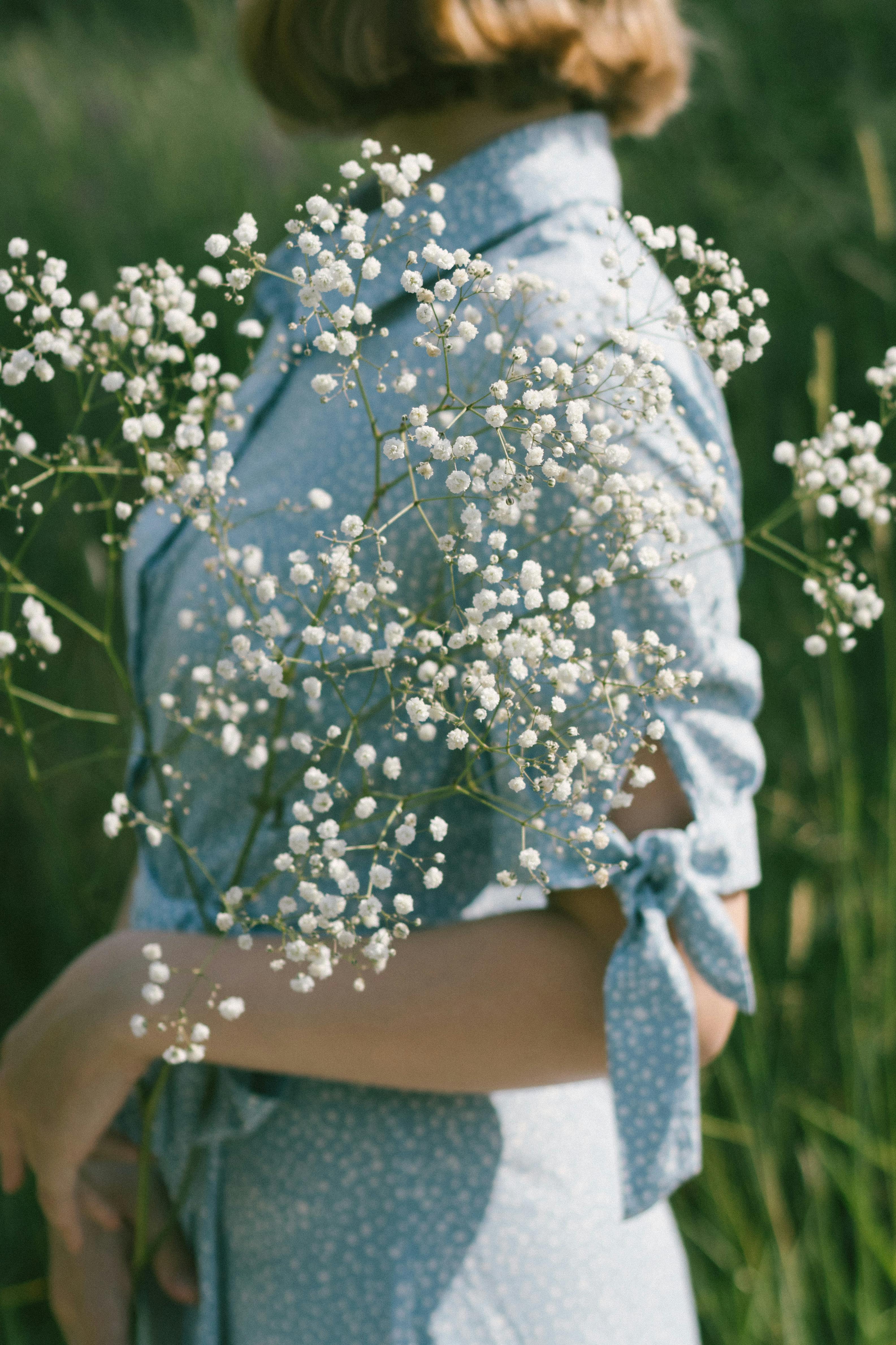 Close-up Photo of Woman in Black Night Dress Holding White Flower ...