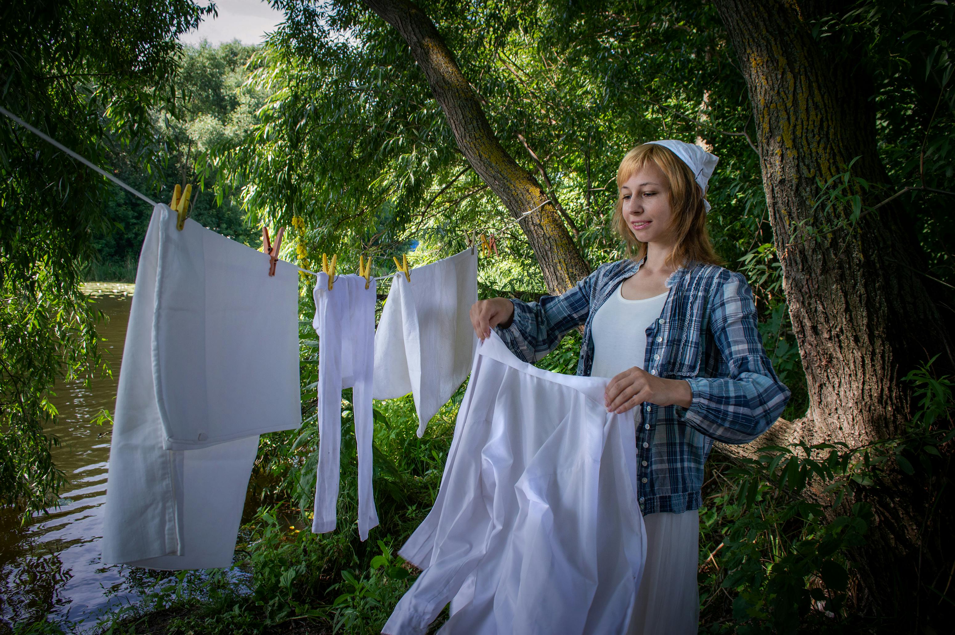 Woman Washing Clothes in a lake · Free Stock Photo