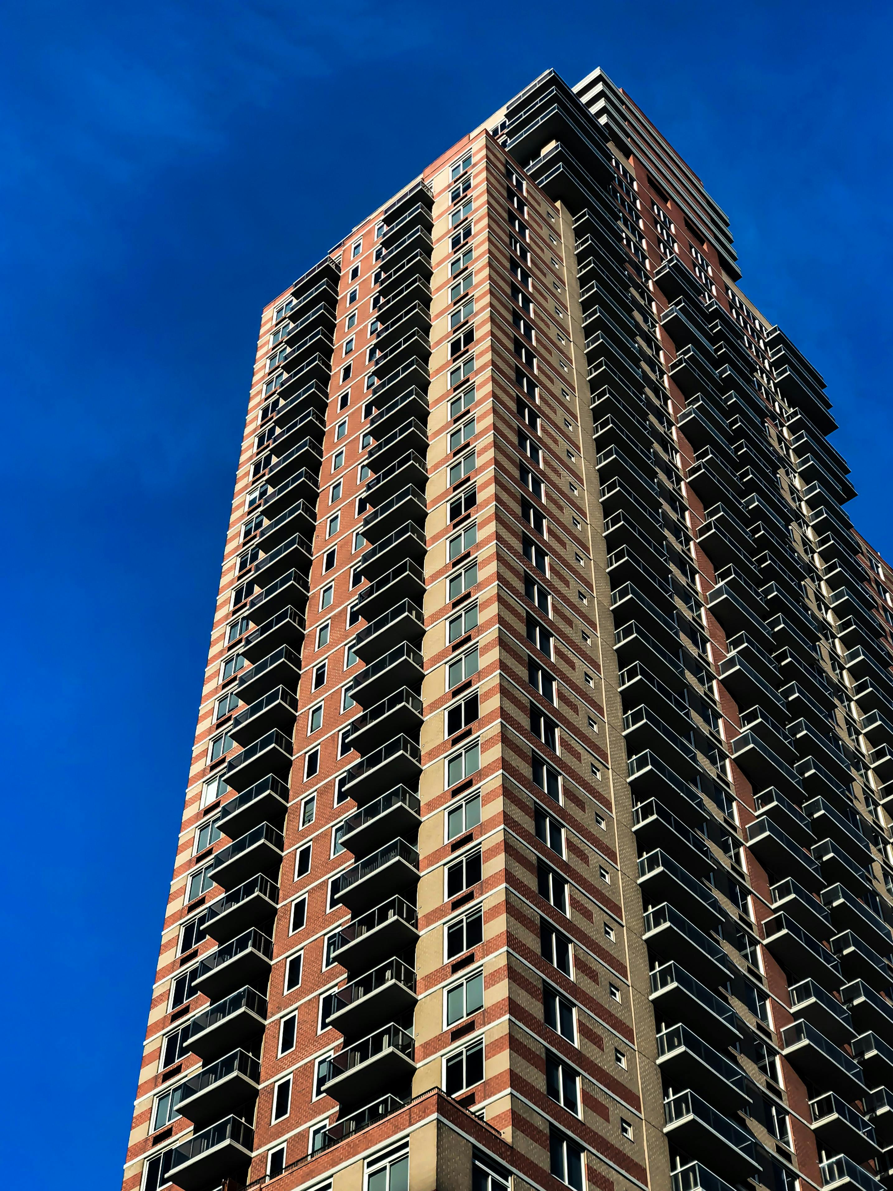 Woman Standing Next to Building · Free Stock Photo