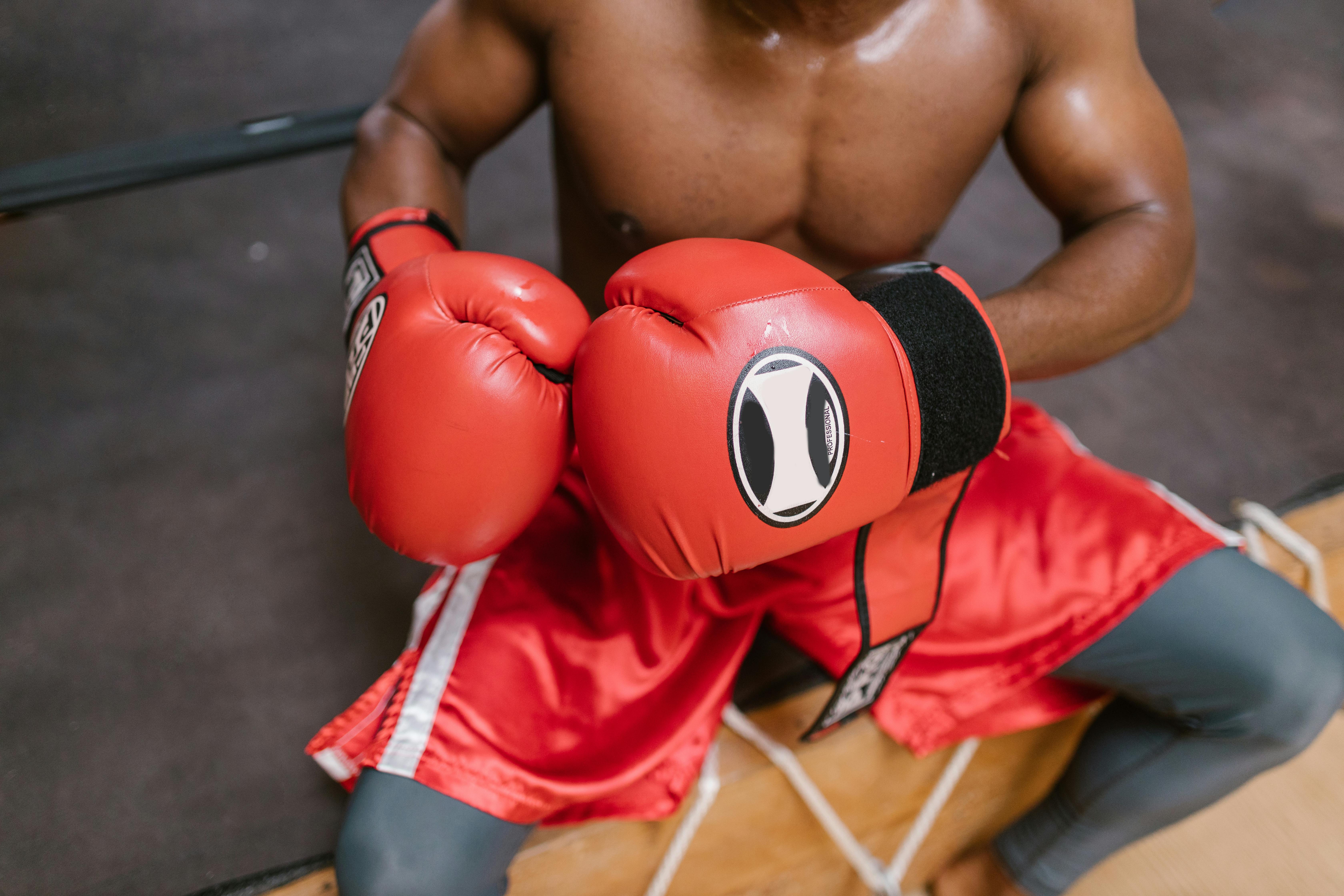 A Brawny Man with Red Boxing Gloves · Free Stock Photo