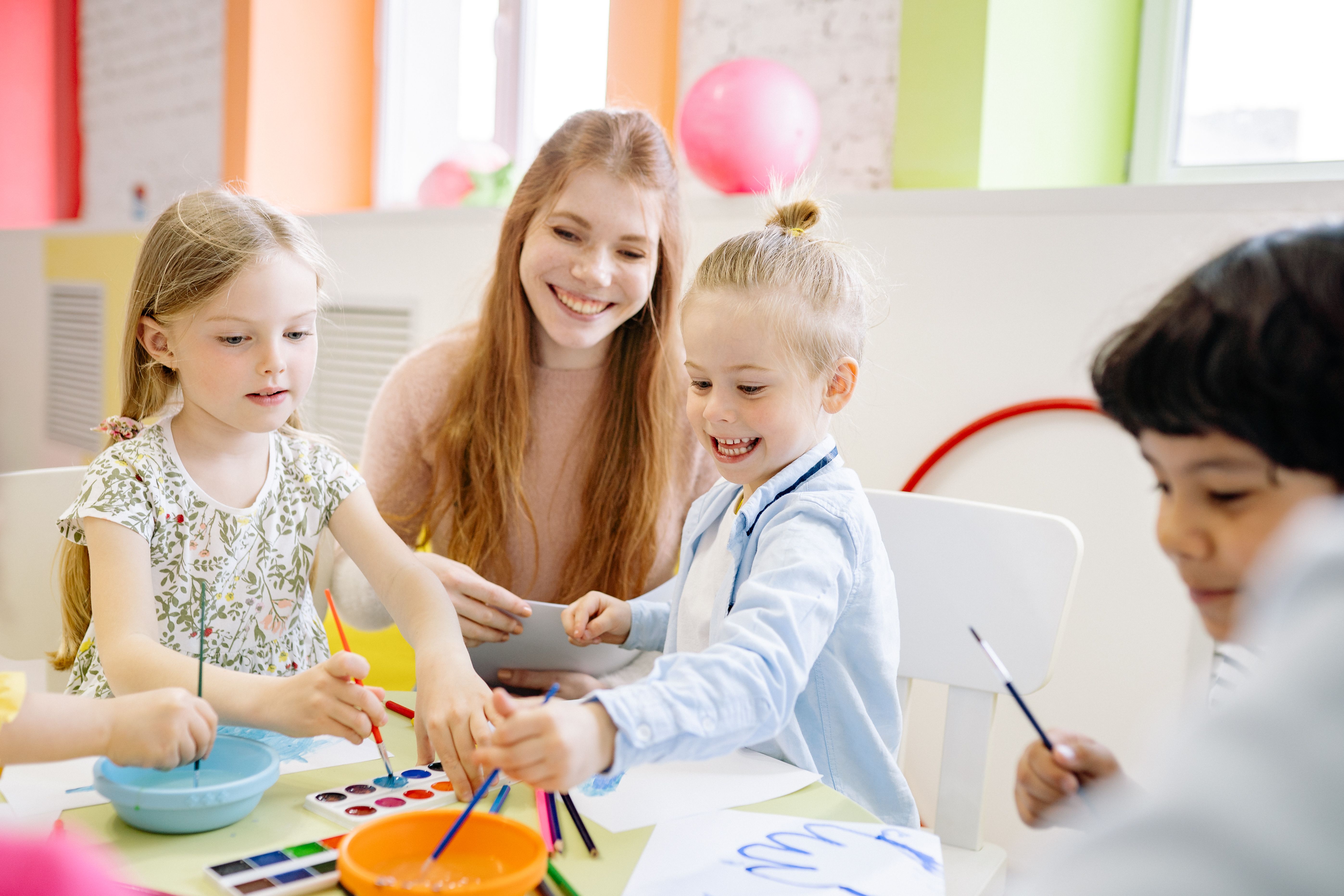 Children Learning To Paint With Water Color · Free Stock Photo