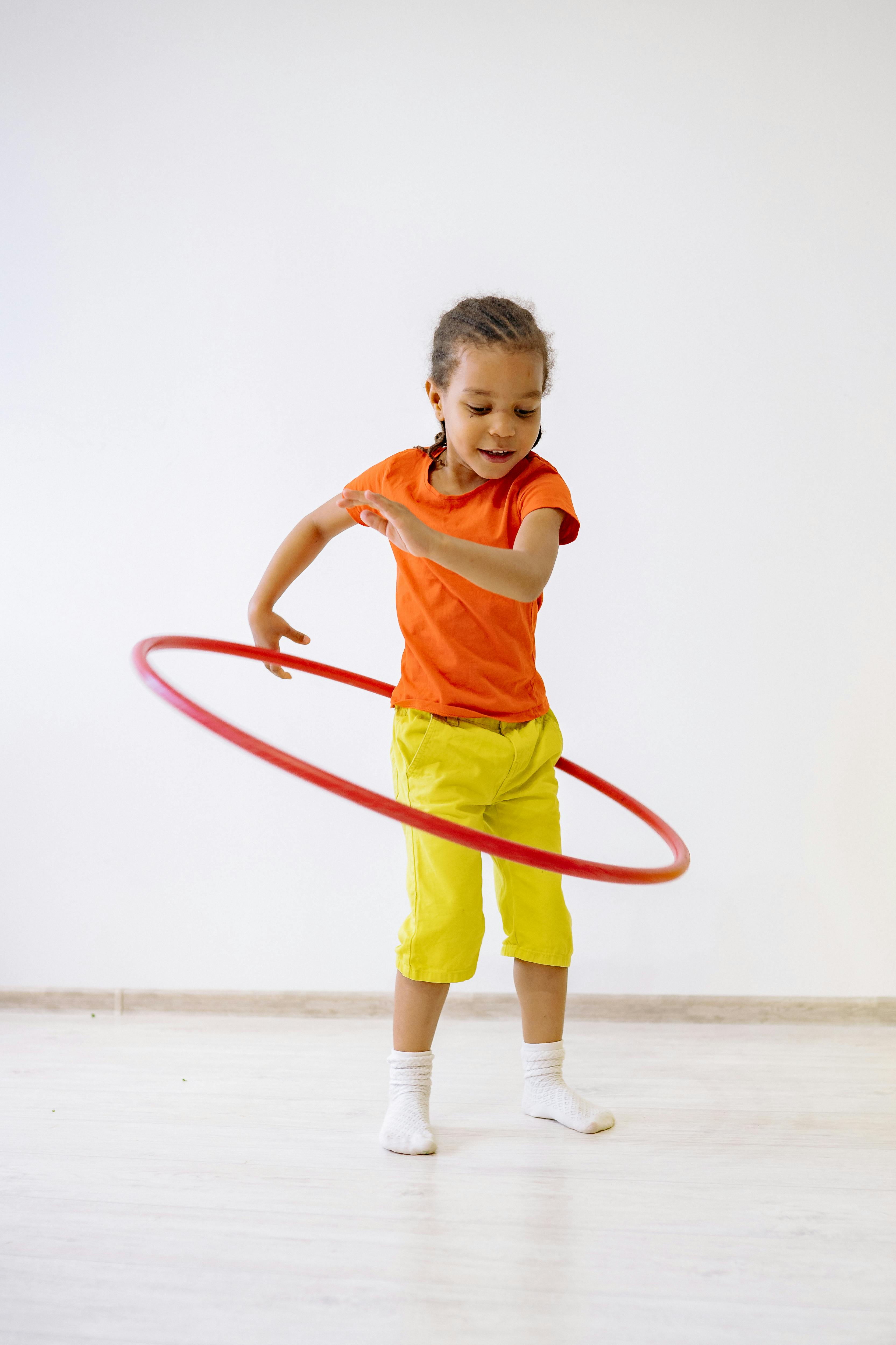 A Girl Using a Hula Hoop · Free Stock Photo