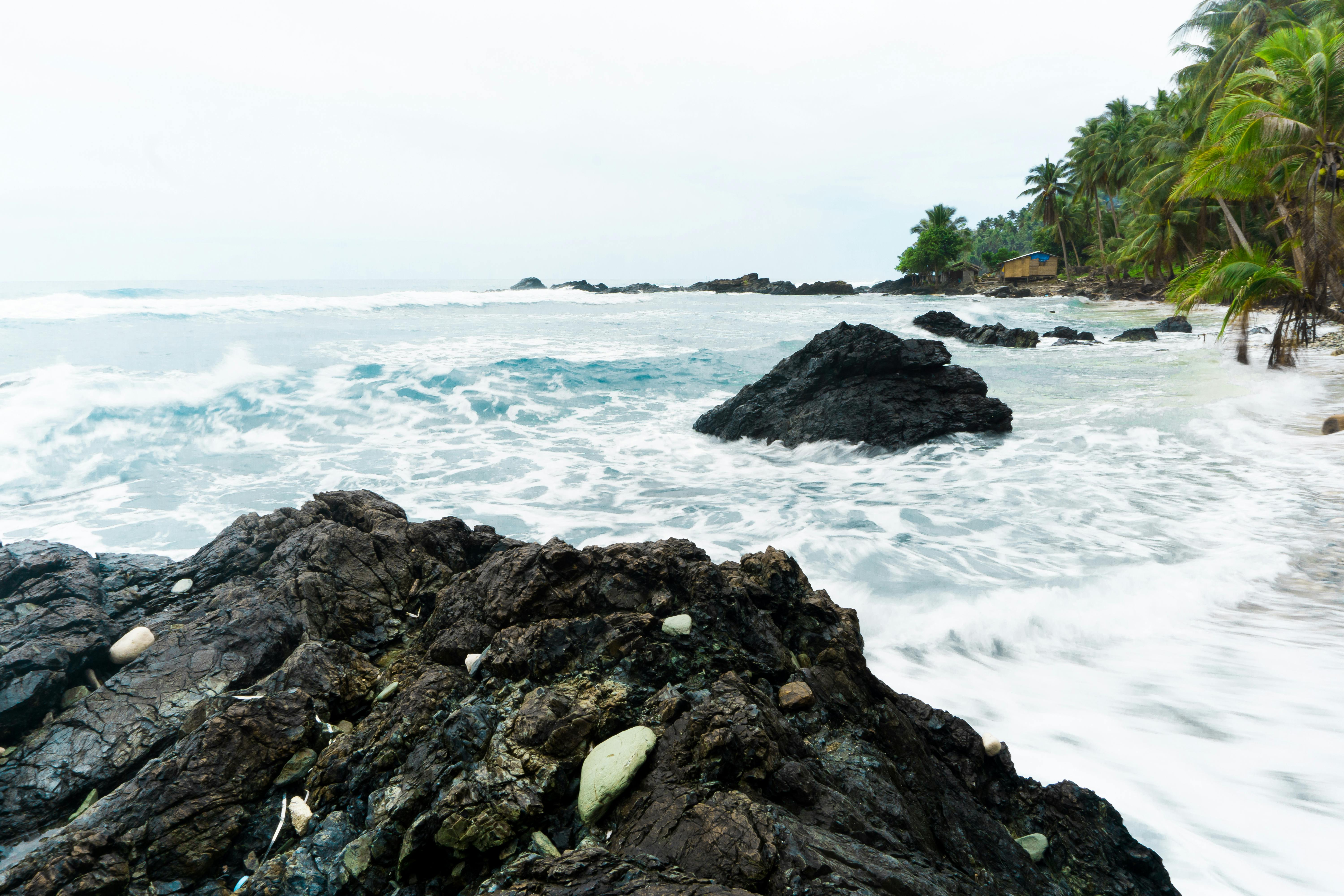 Gray Rock Formations on Sea · Free Stock Photo