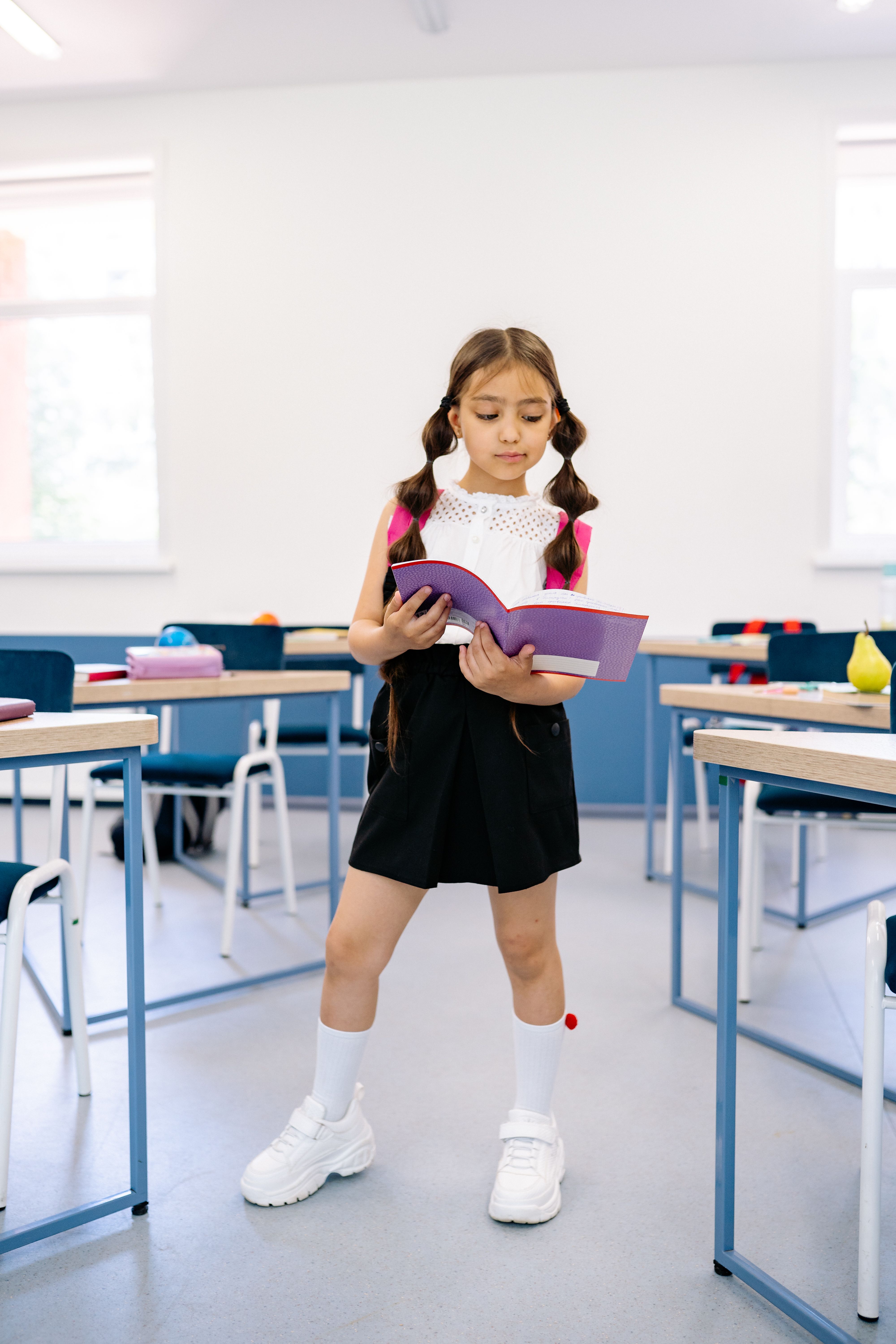 Kid Holding Notebooks at School · Free Stock Photo