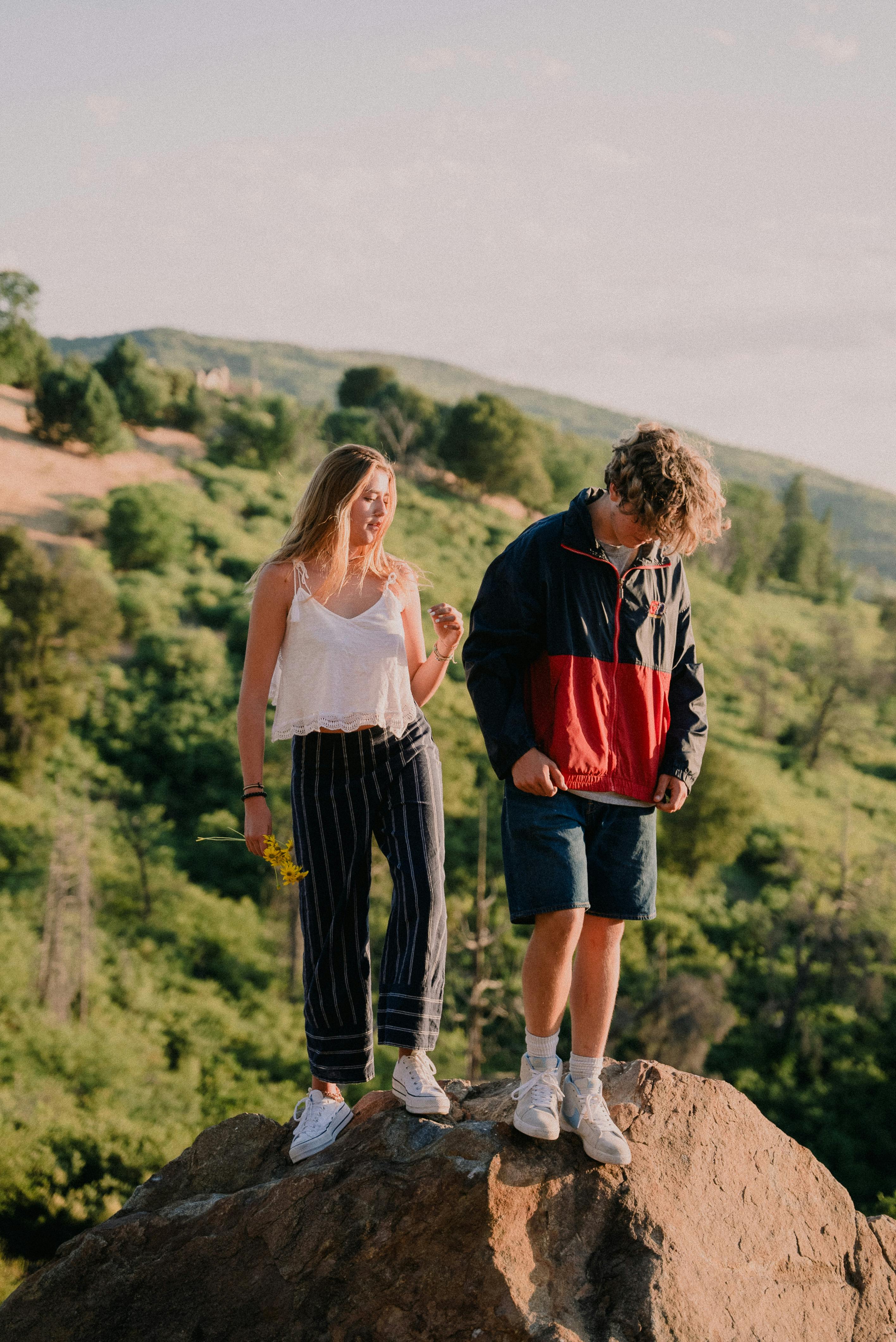 Man and Woman Standing on a Rock · Free Stock Photo