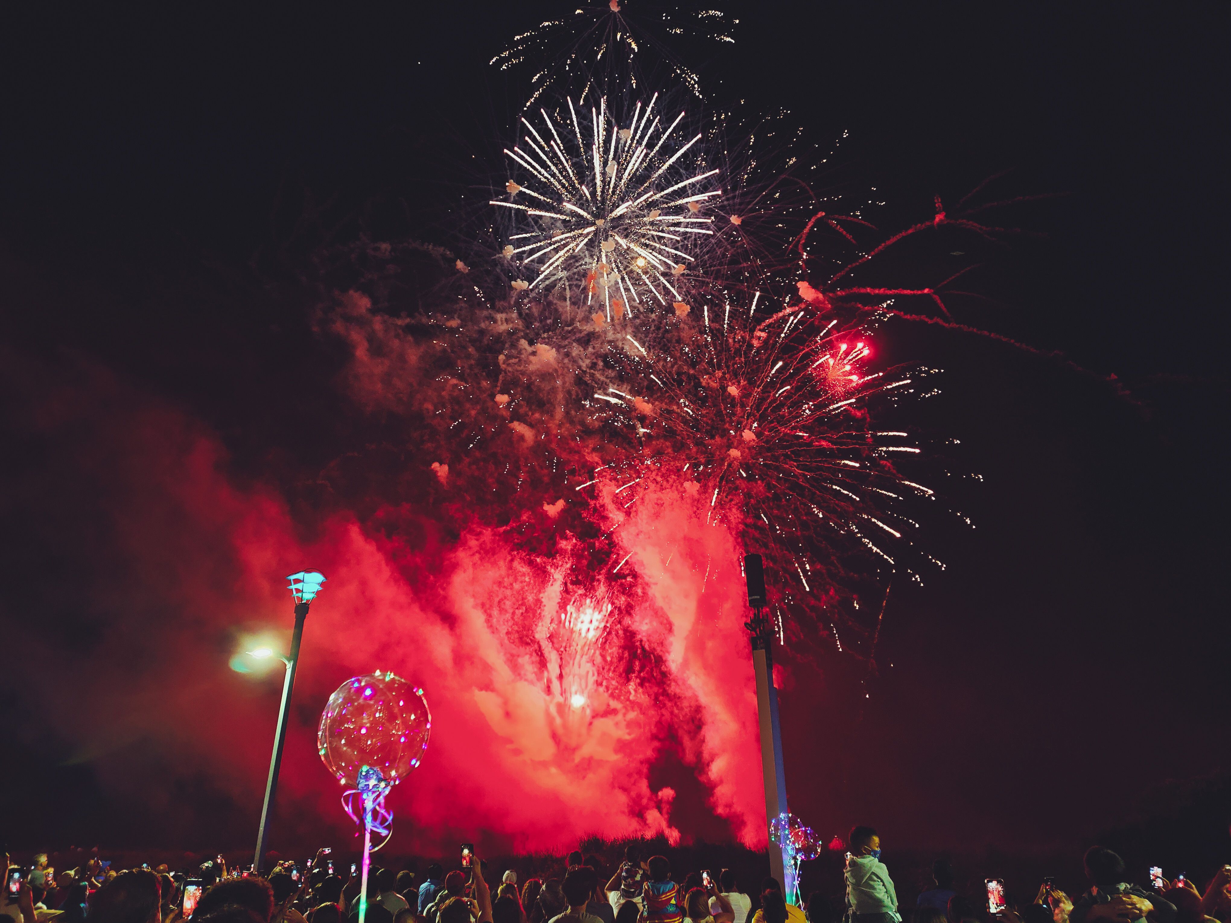 People Watching Fireworks Display on a Dark Sky · Free Stock Photo