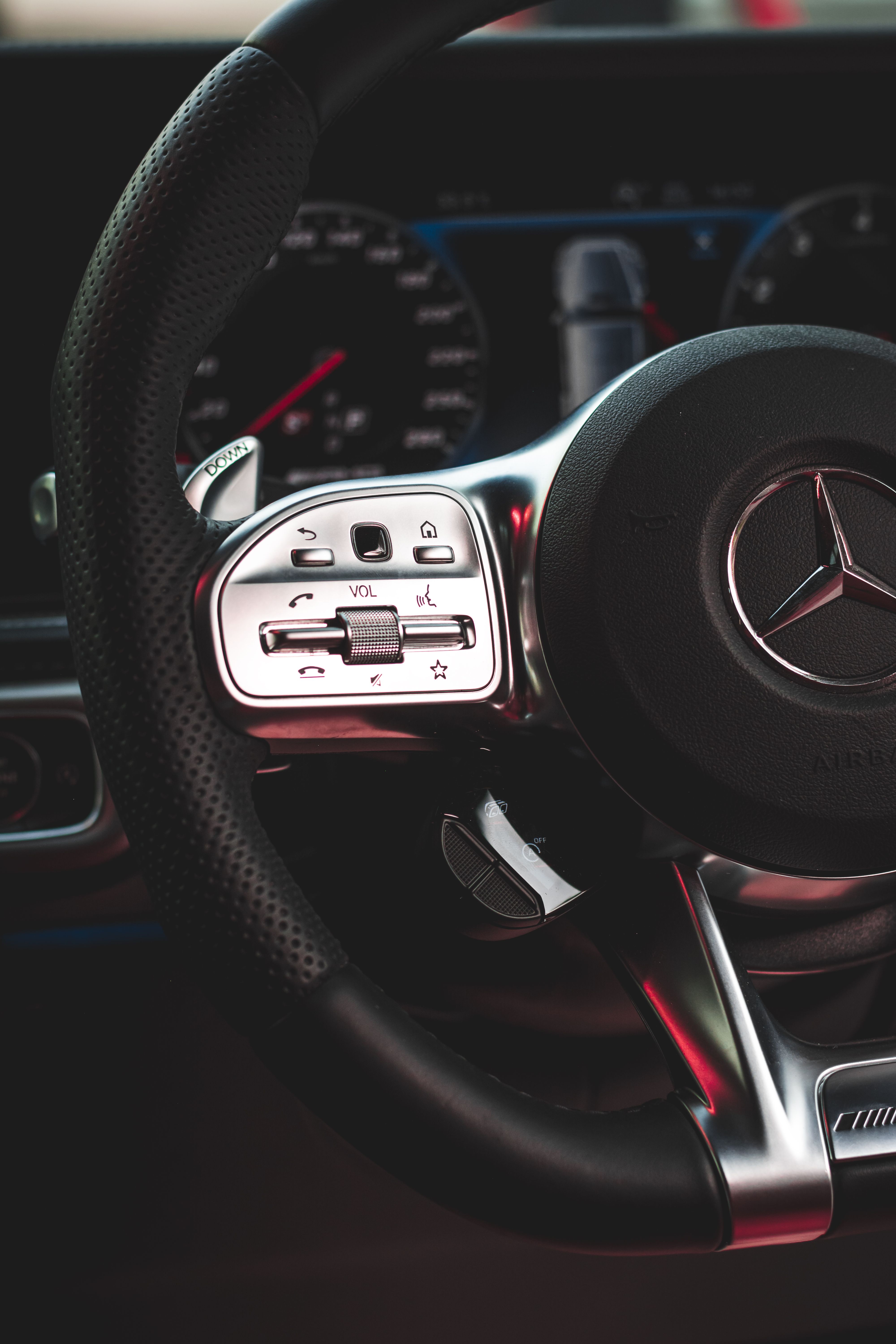 Close-up of Buttons on a Mercedes Benz Steering Wheel · Free Stock Photo
