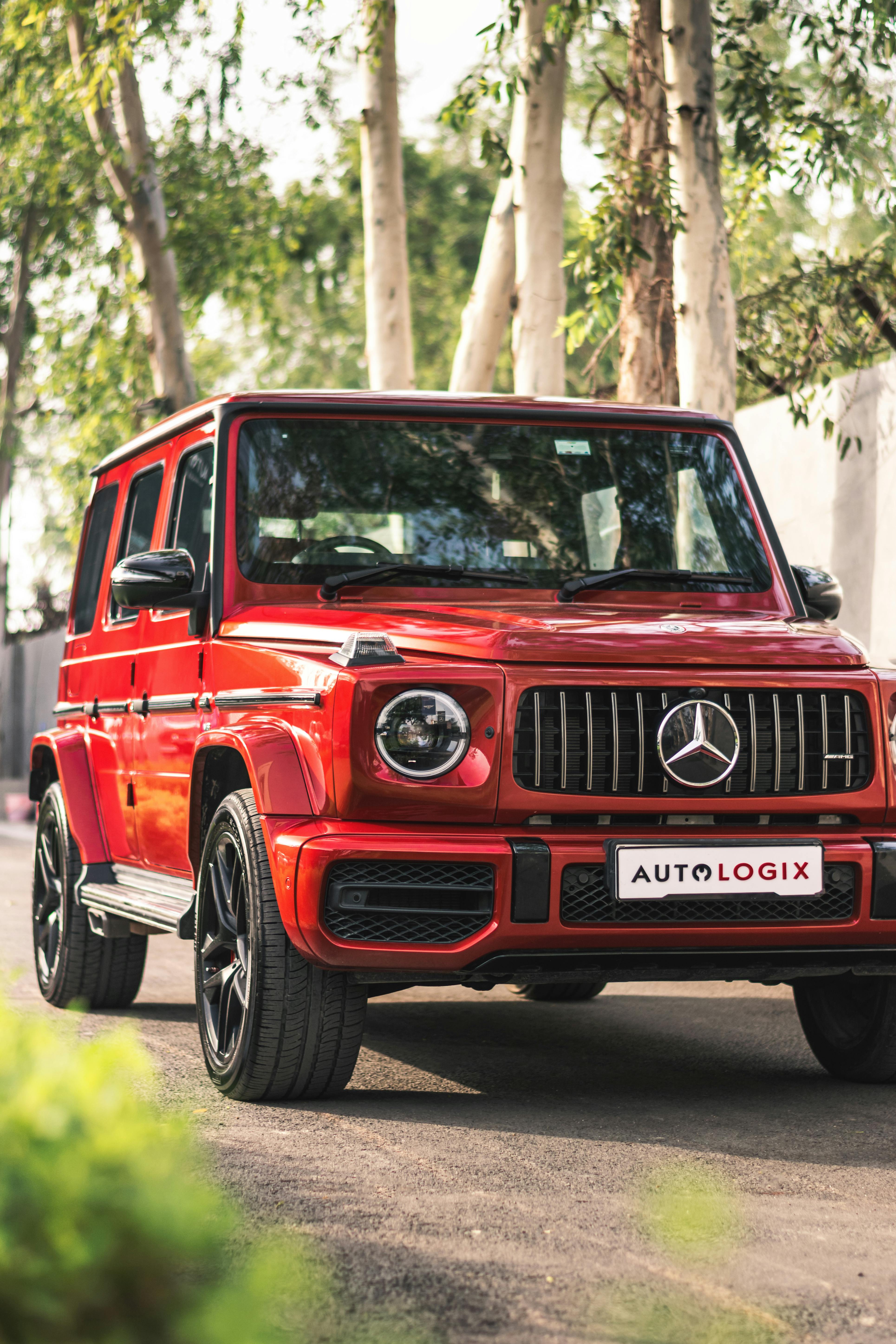 Red and Shiny Car on a Road · Free Stock Photo