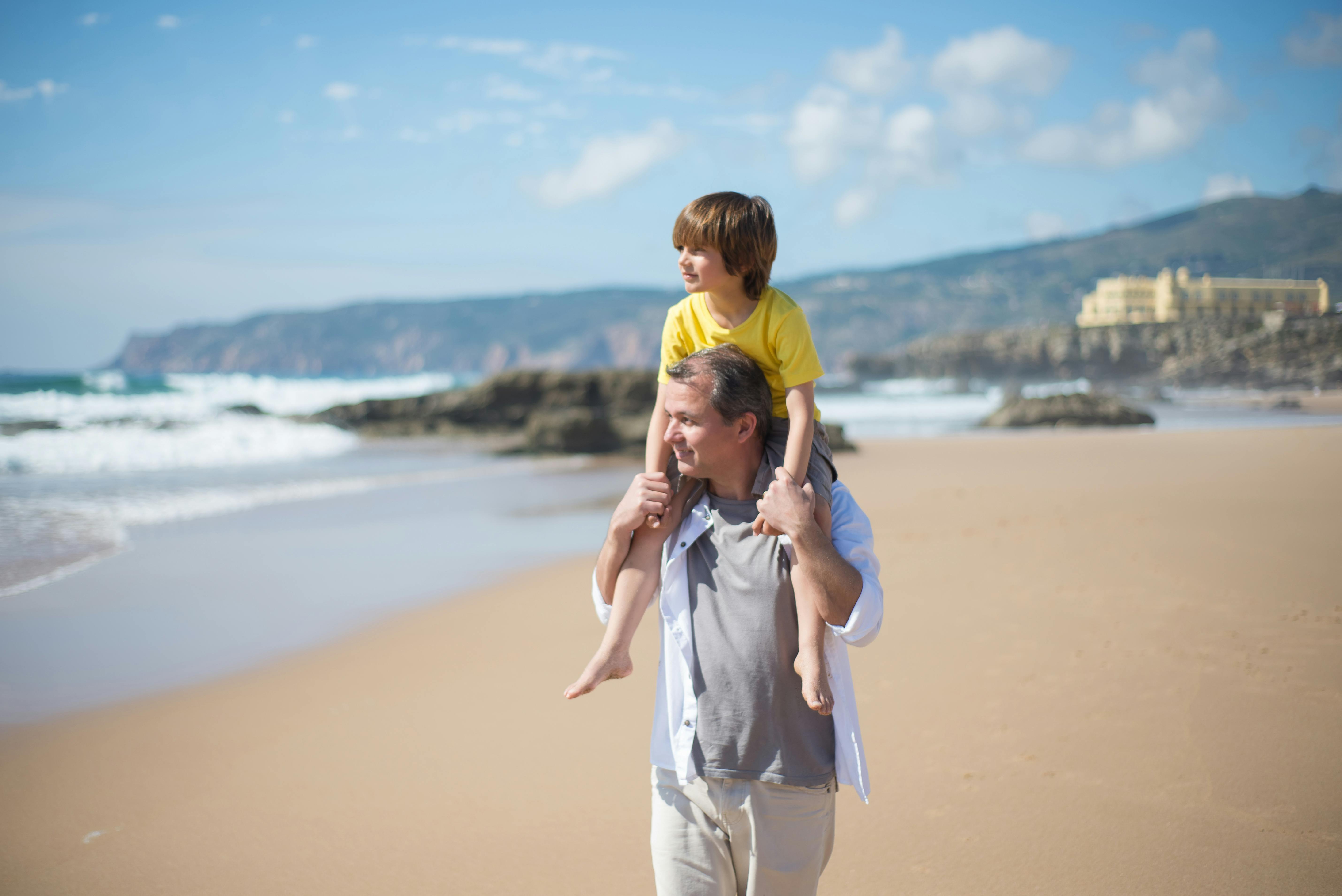 Man with Child on Sea Shore in Istanbul on Photographic Film · Free ...