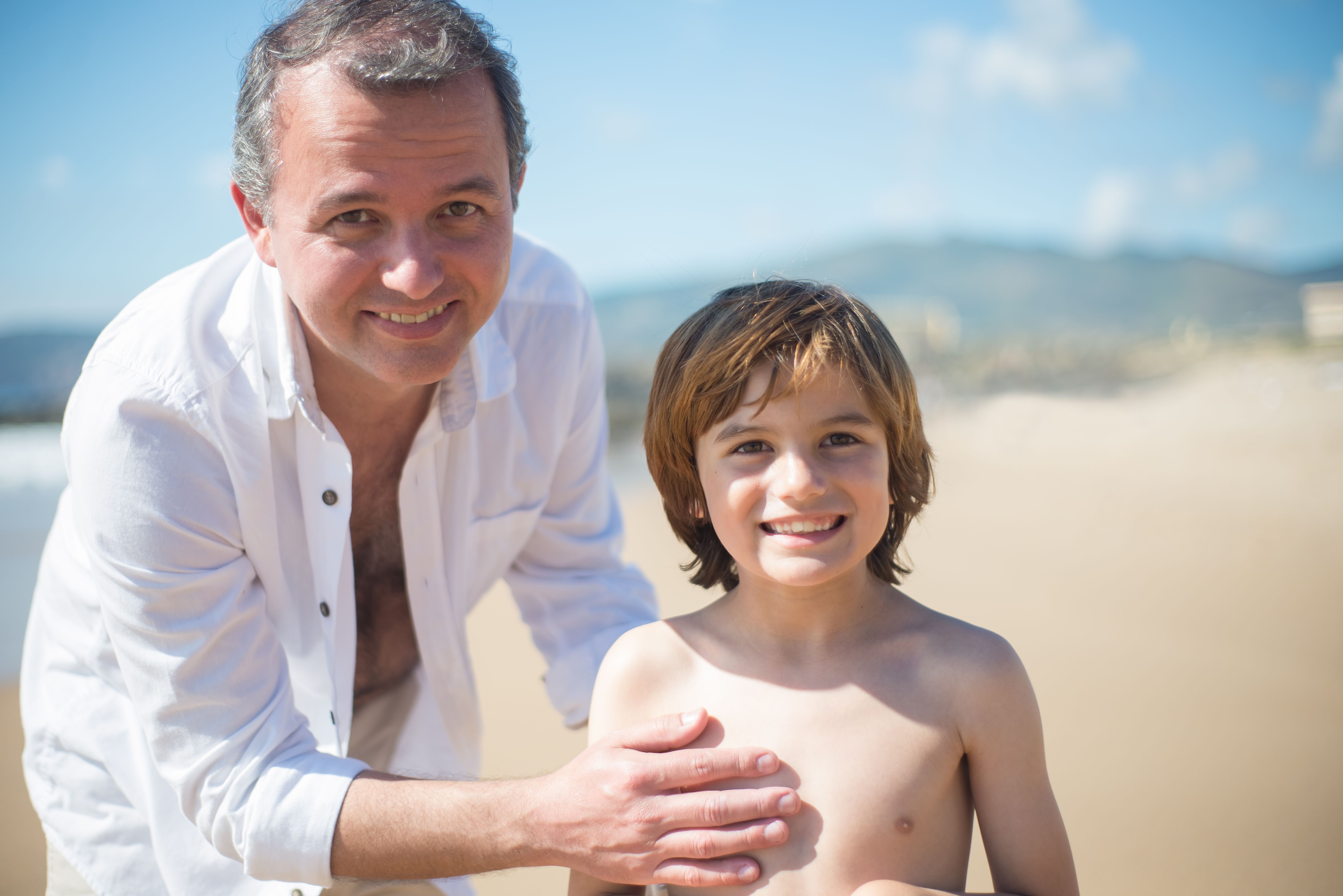 Man and a Boy Standing Beside a Truck · Free Stock Photo