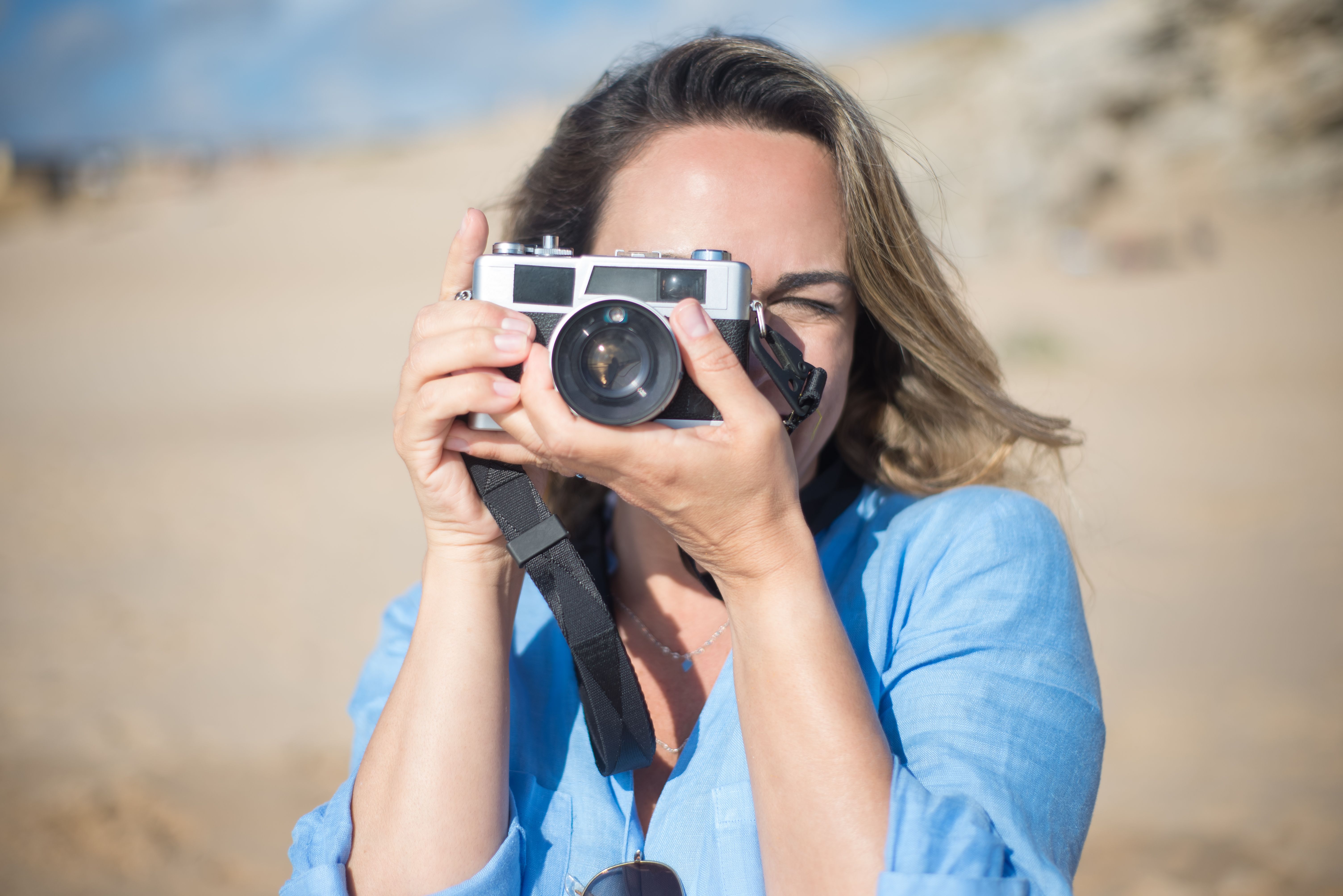 Close-Up Shot of a Woman Taking a Picture · Free Stock Photo
