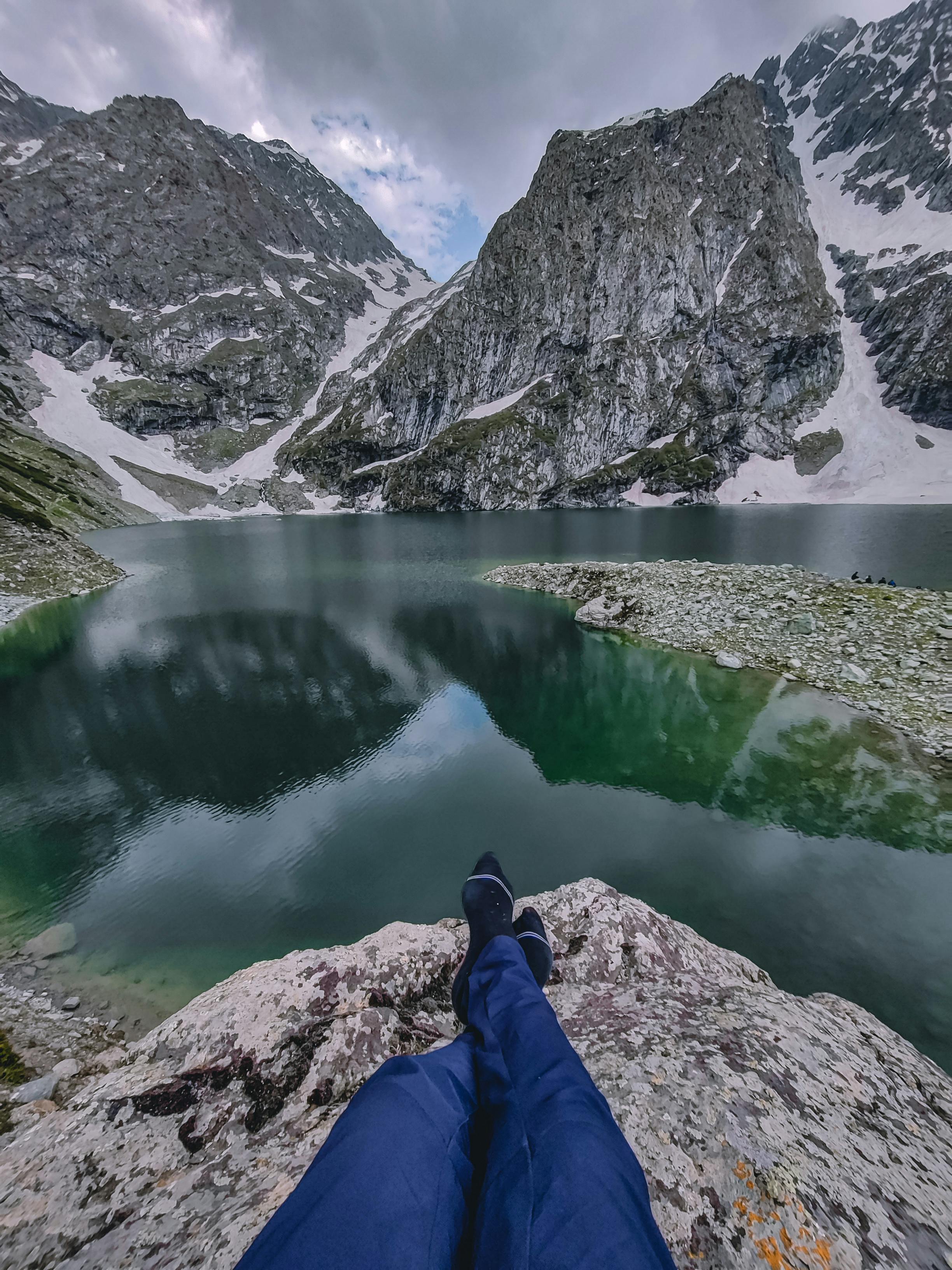 A Person Relaxing on a Rock with a Beautiful View of Nature · Free ...