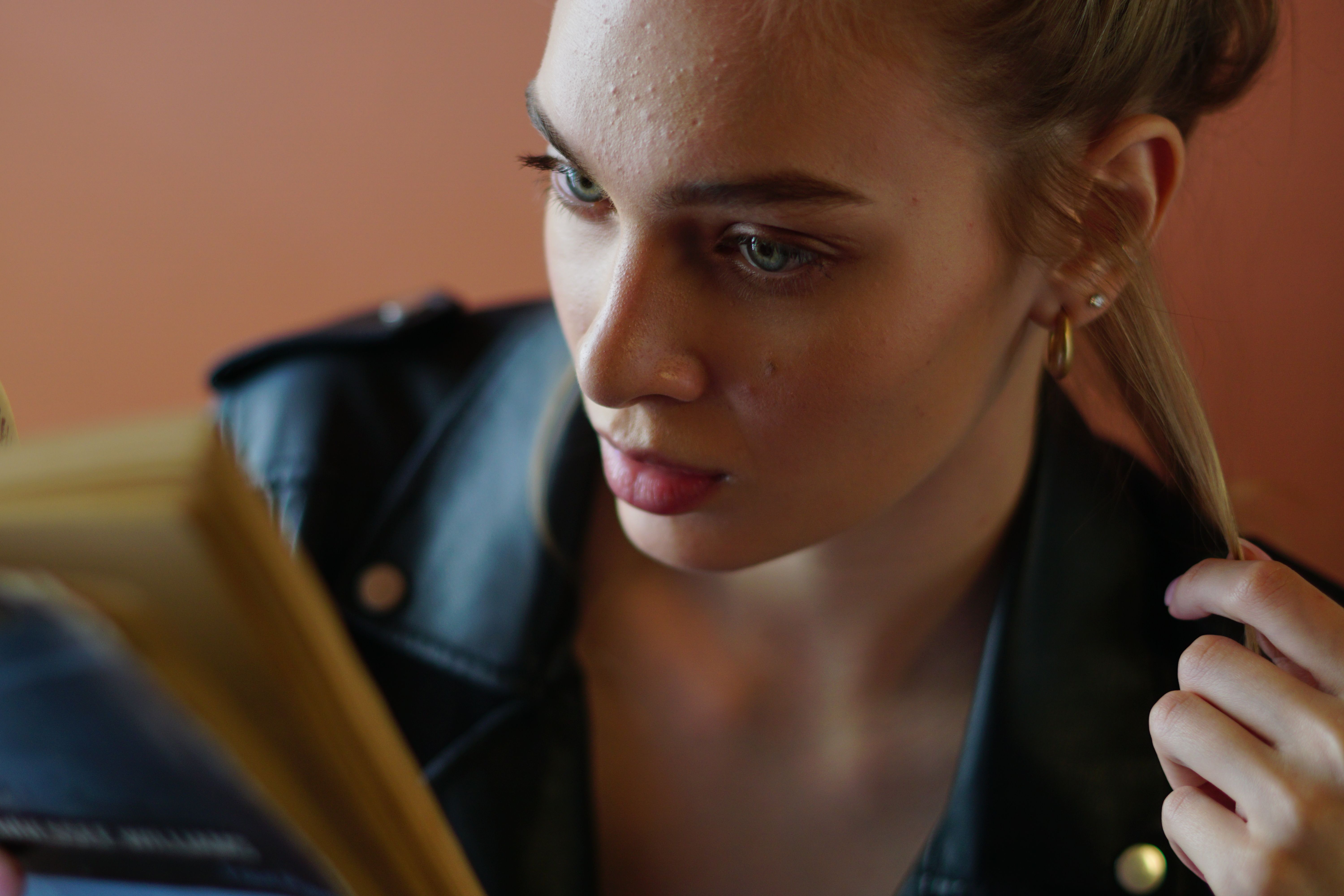 Woman with Blue Eyes Reading Book · Free Stock Photo