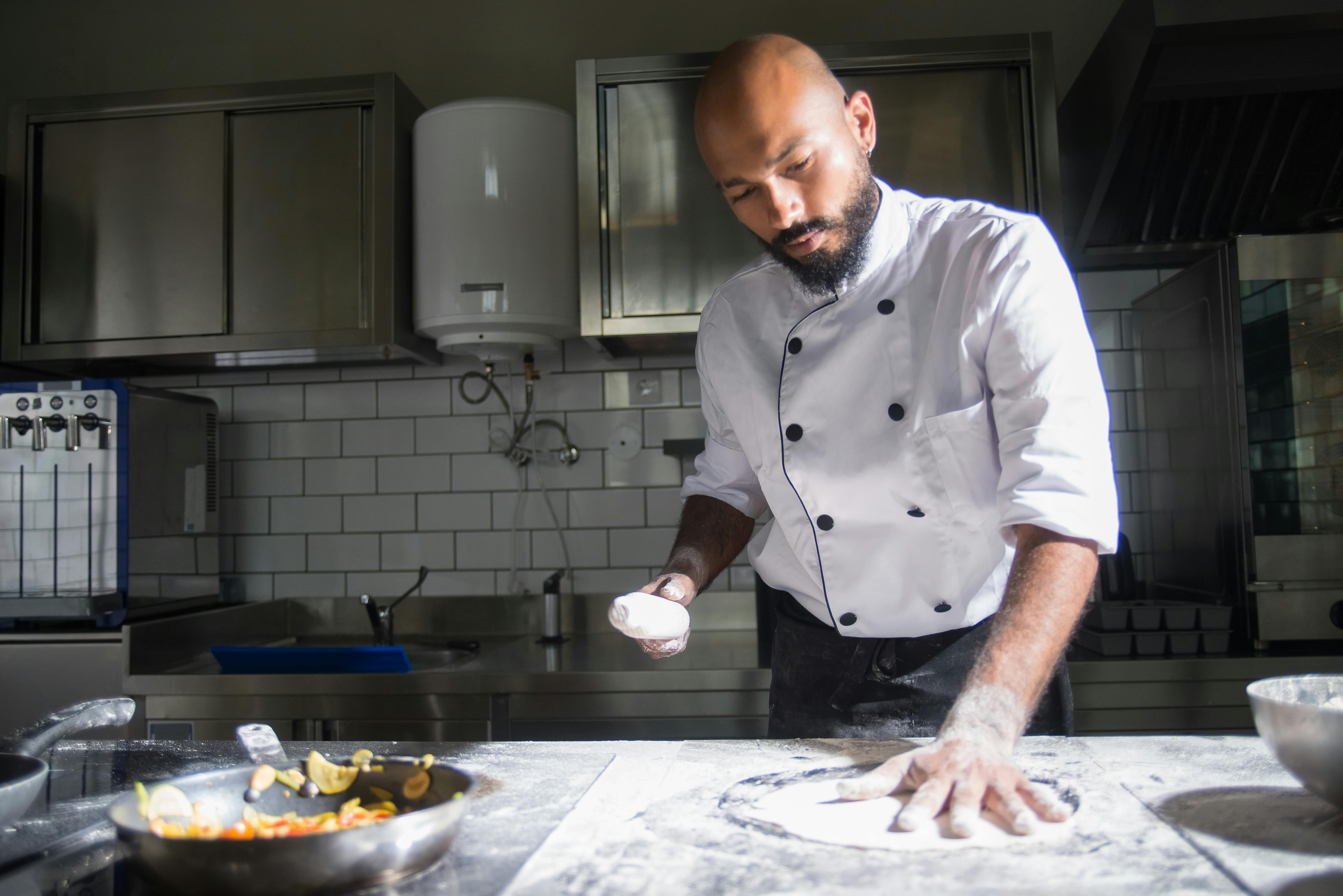 Man Wiping Butter on a Bowl · Free Stock Photo