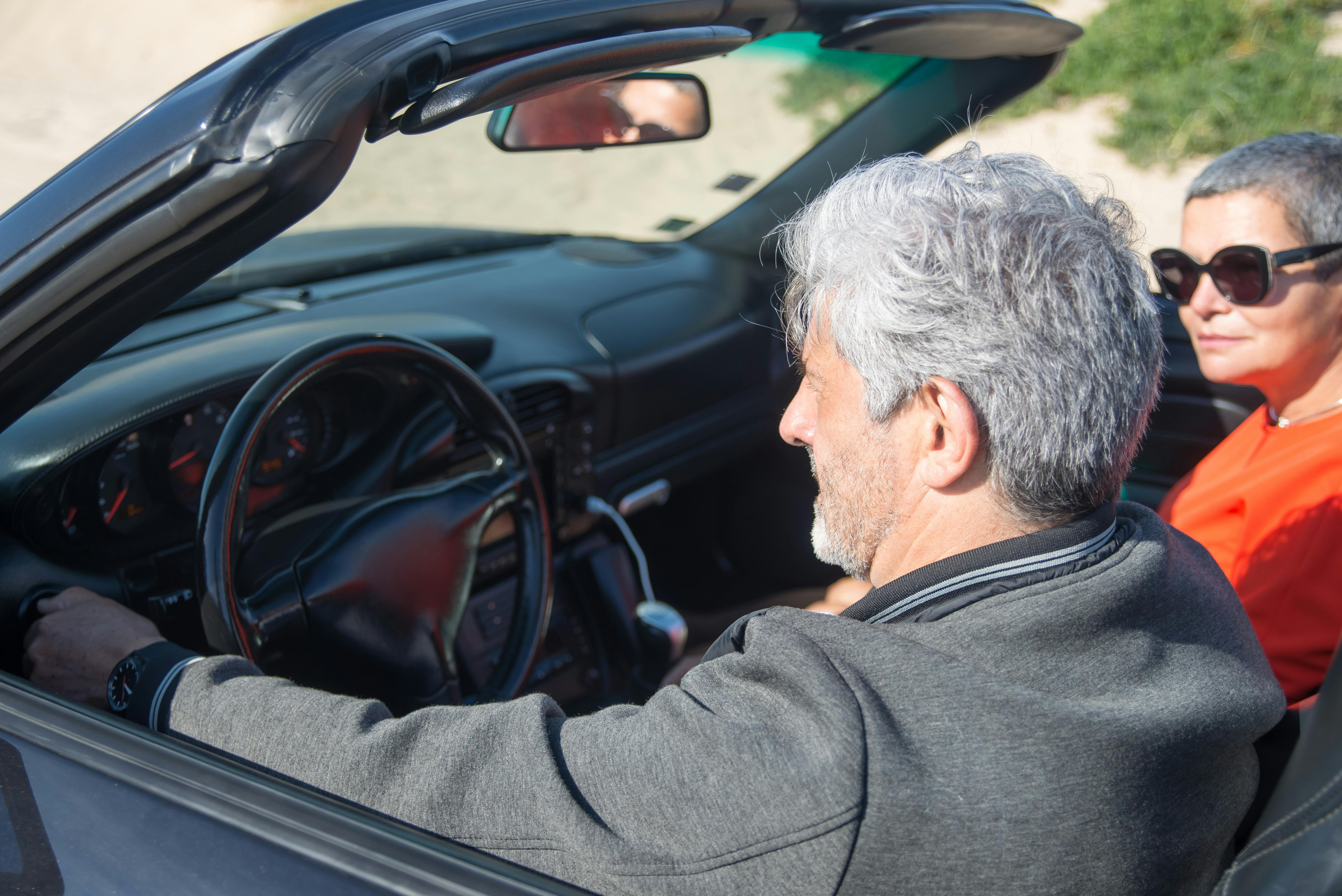 A Woman Driving a Top Down Vehicle · Free Stock Photo