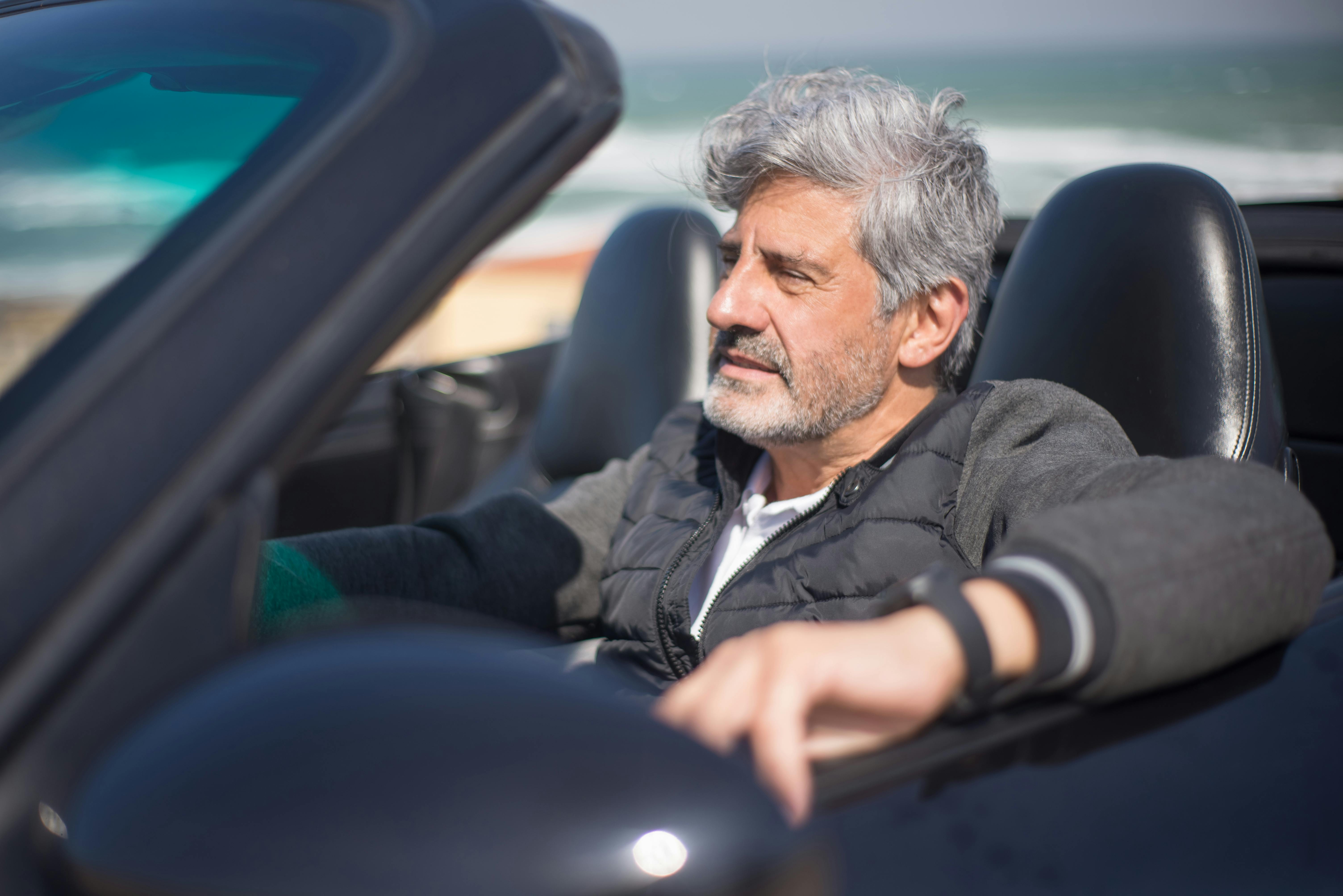 Elderly Man Driving a Tractor · Free Stock Photo
