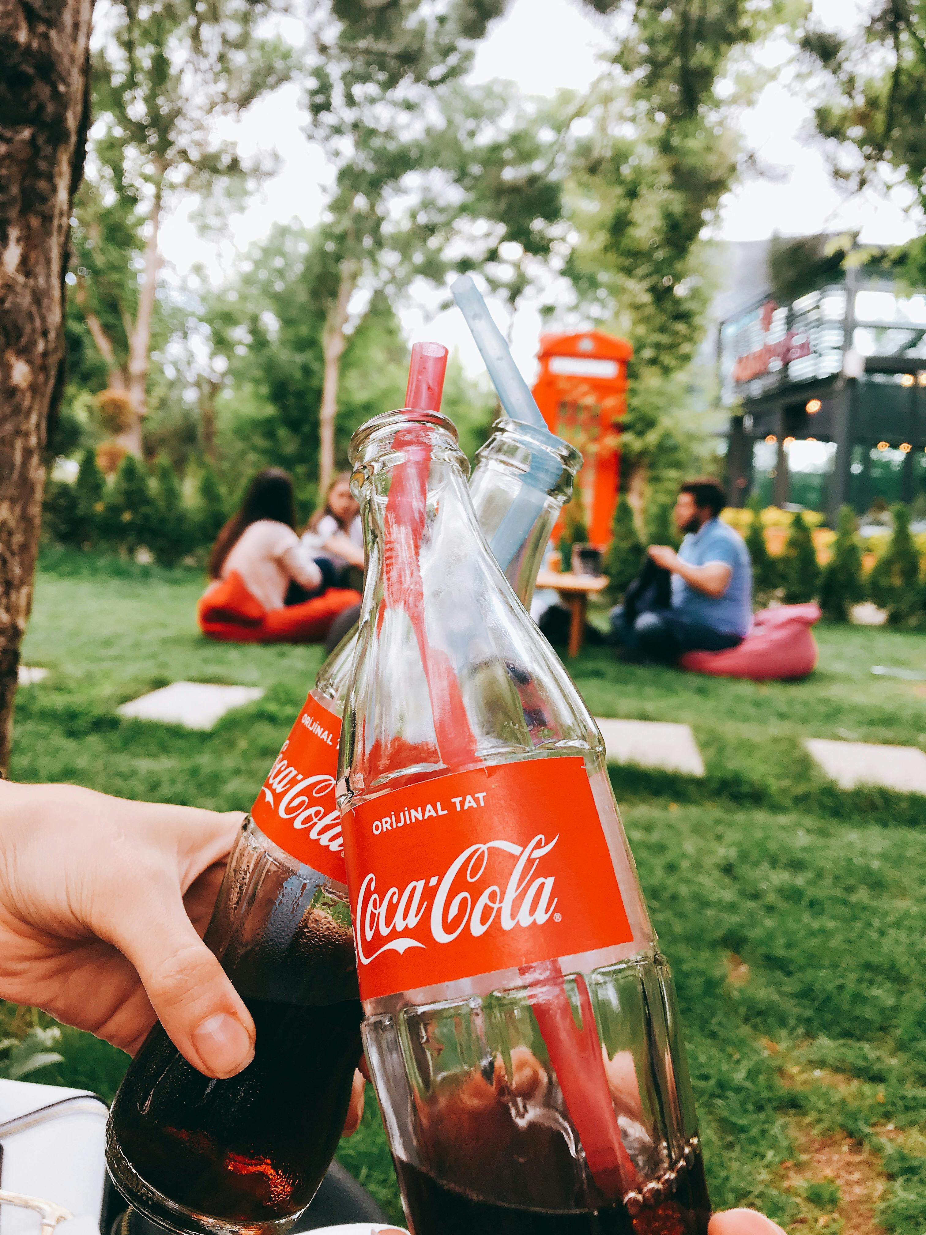 Three White and Brass Coca-cola Bottles · Free Stock Photo