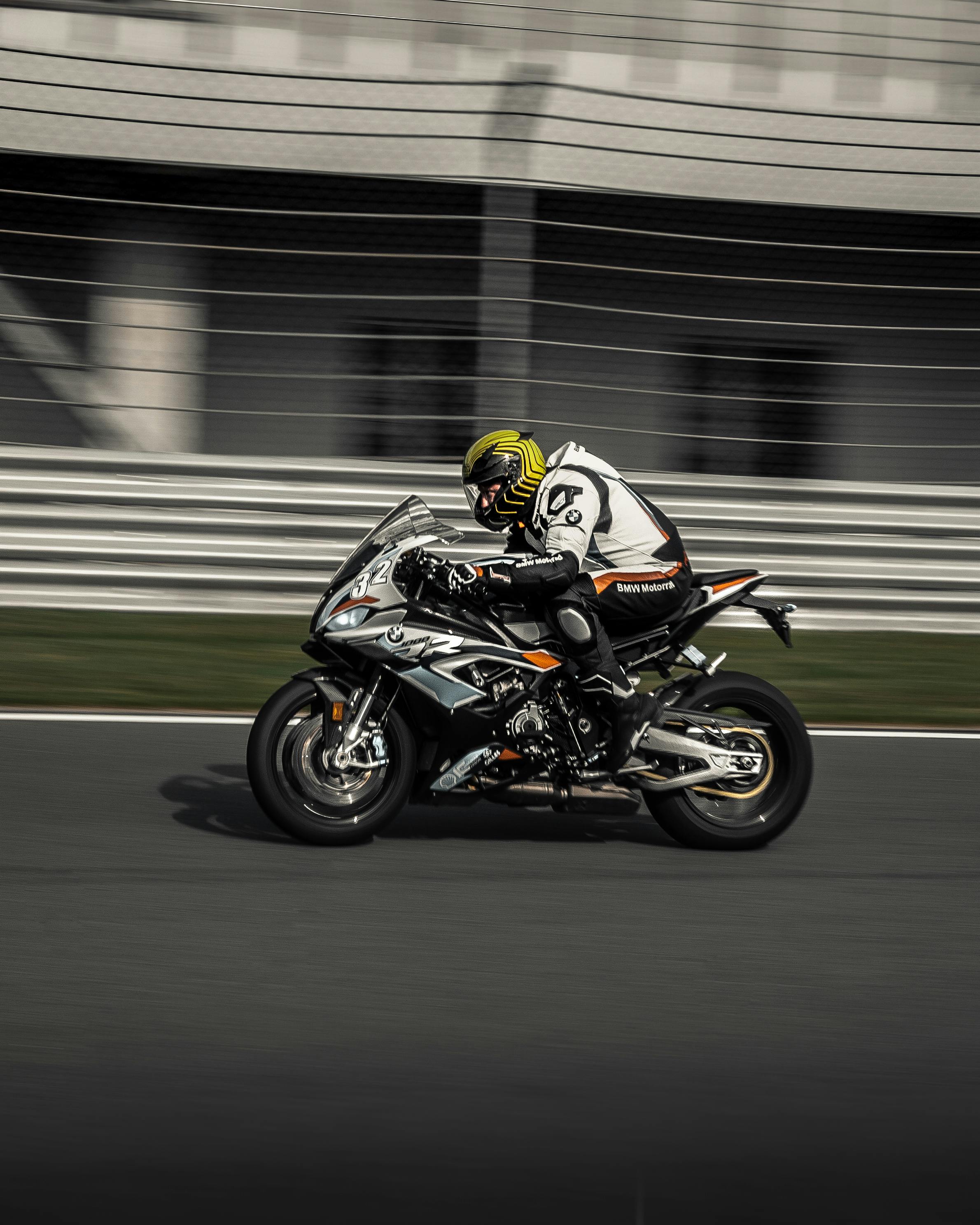 Person Riding a Motorcycle on Asphalt Road · Free Stock Photo