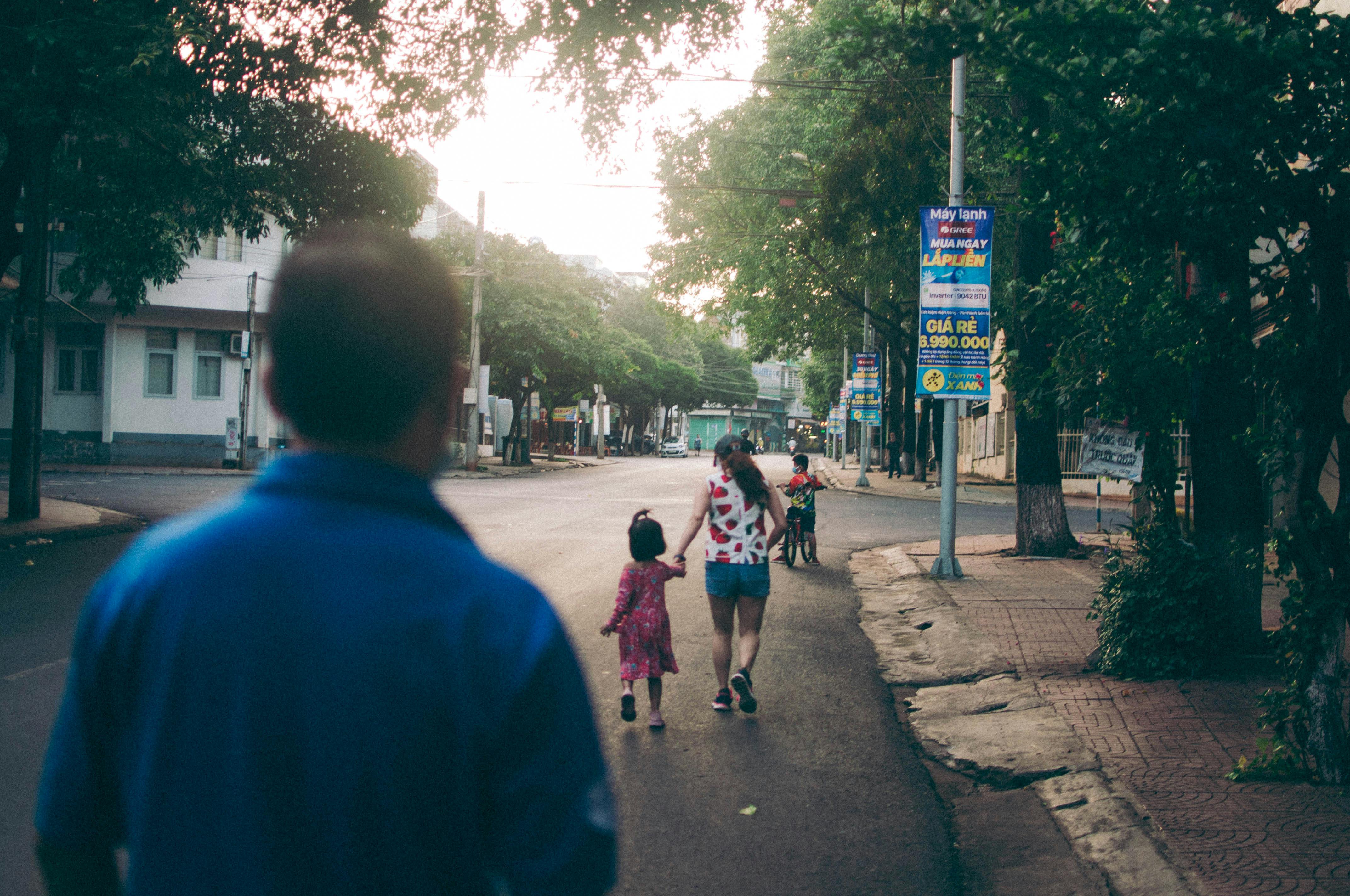 Family Walking on a Street · Free Stock Photo