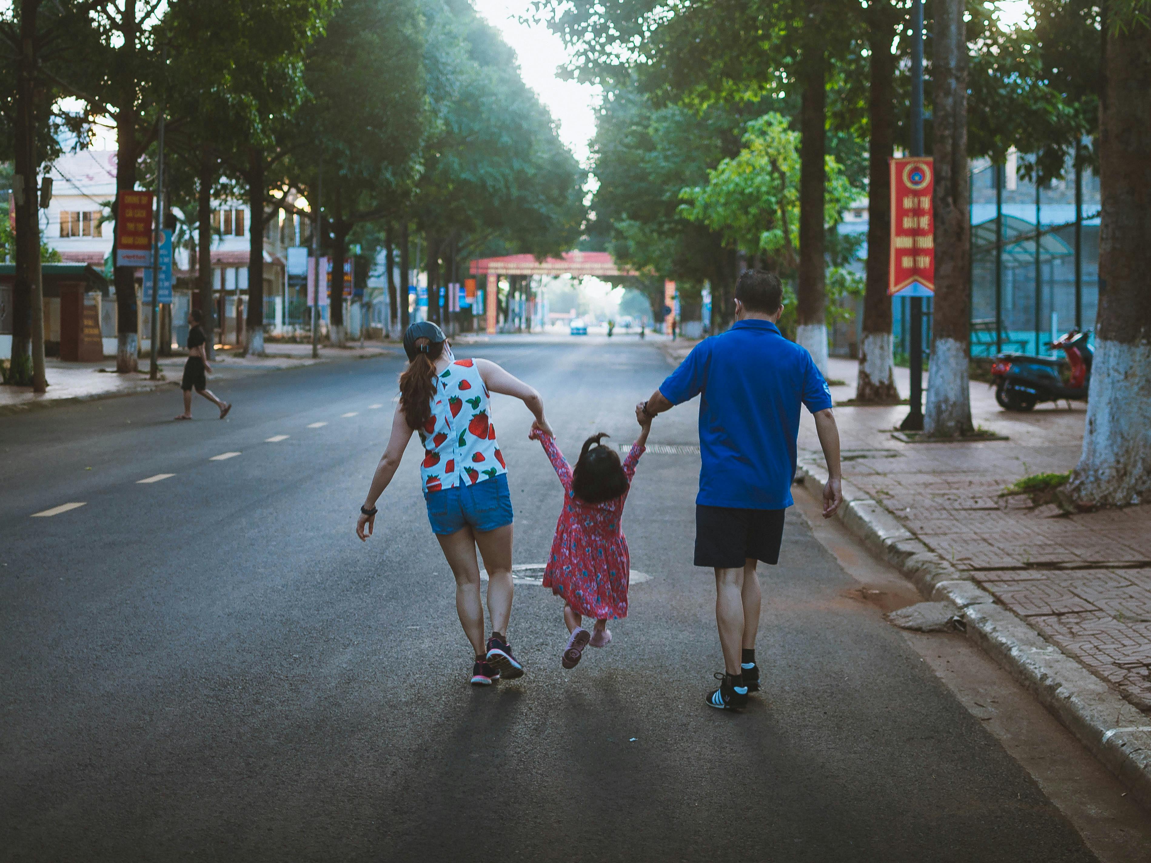 A Family Walking on the Street · Free Stock Photo