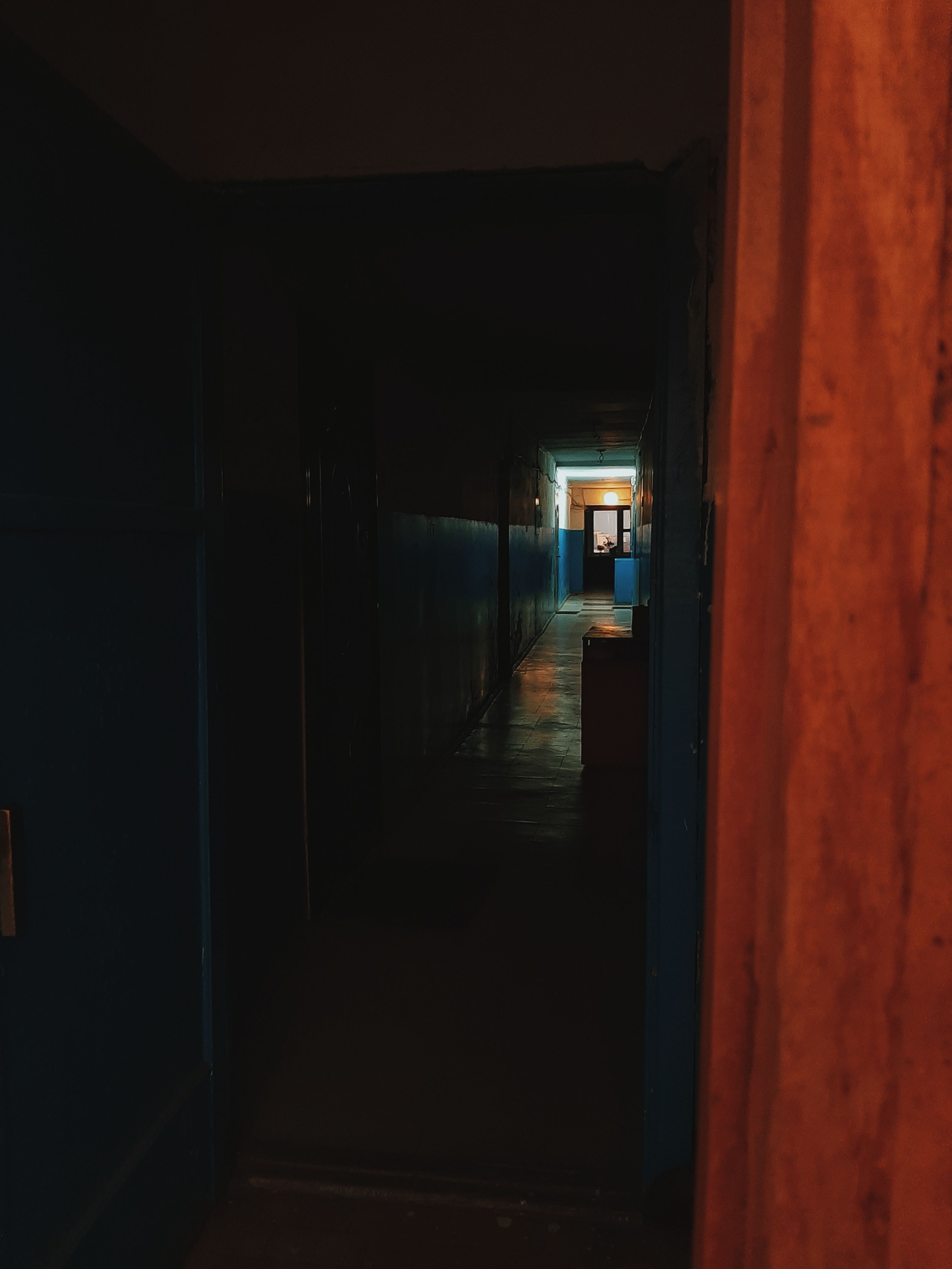 An Empty Dark Hallway Illuminated with Lights · Free Stock Photo